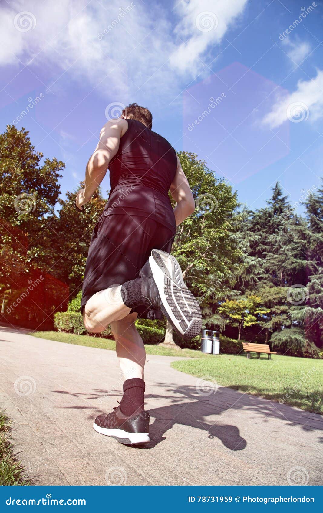Low Angle Rear View of Caucasian Man Running in Park Stock Image ...
