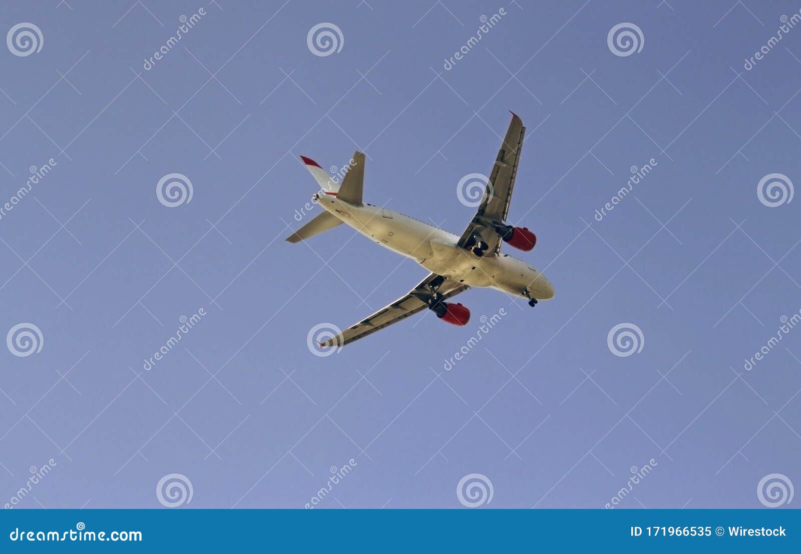 Low Angle Shot of an Airplane Flying Up High in the Sky Stock Image ...