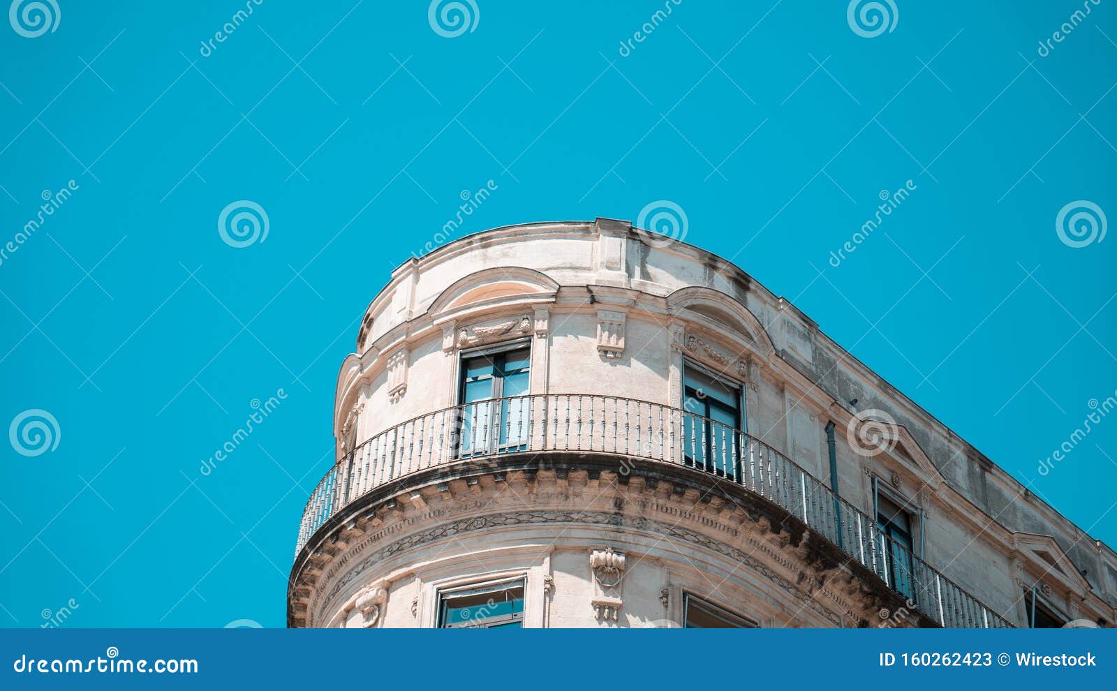 Low Angle Shot of an Architectural Building with Windows and Balcony ...