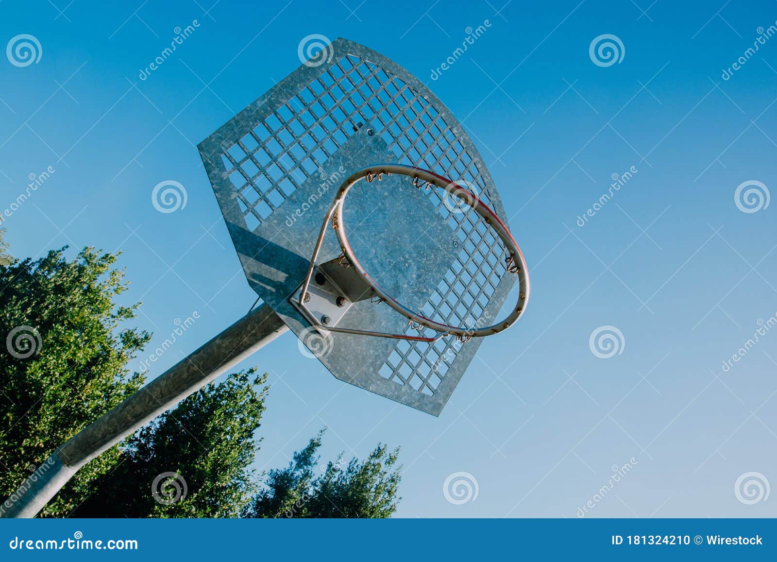 Low Angle Shot of a Basketball Hoop Under a Clear Blue Sky Stock Photo ...