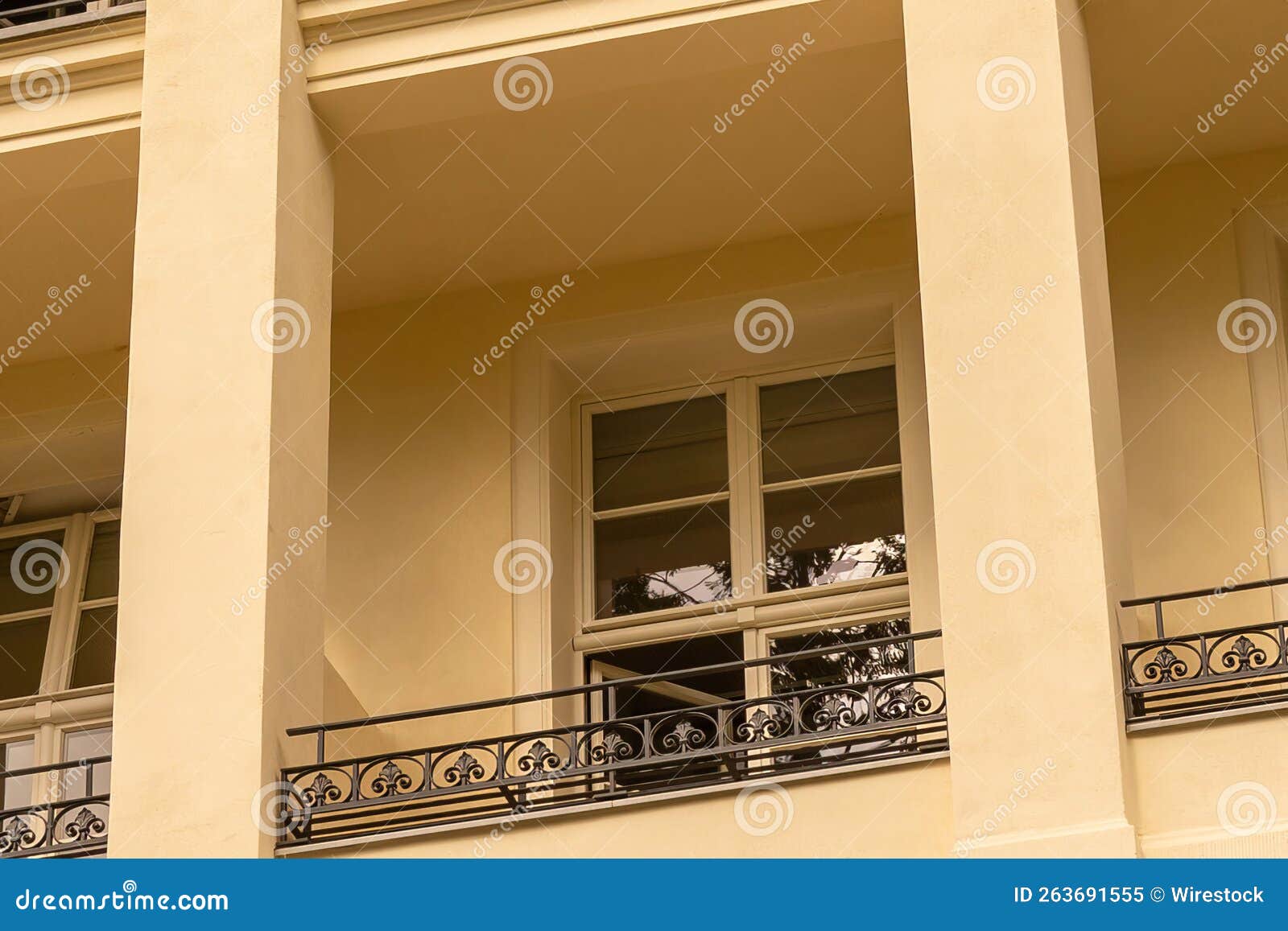 Low-angle Shot of a Beige Classic Balcony with Metallic Railings Stock ...
