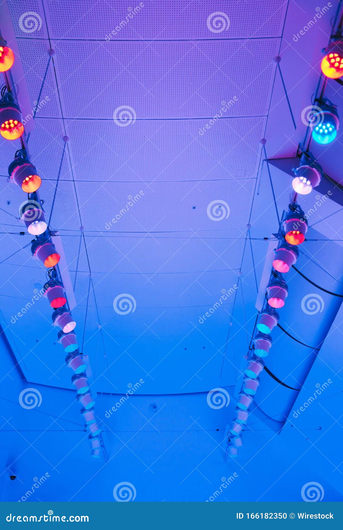 Low Angle Shot of a Blue Gradient Ceiling with Colorful Lights Hanging ...