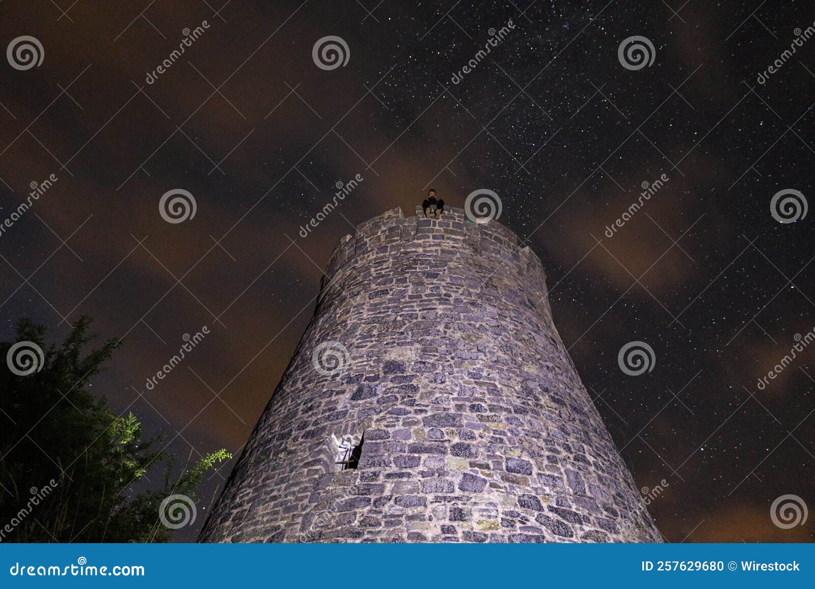 Low-angle Shot of a Brick Tower with a Scenic Night Sky in the ...