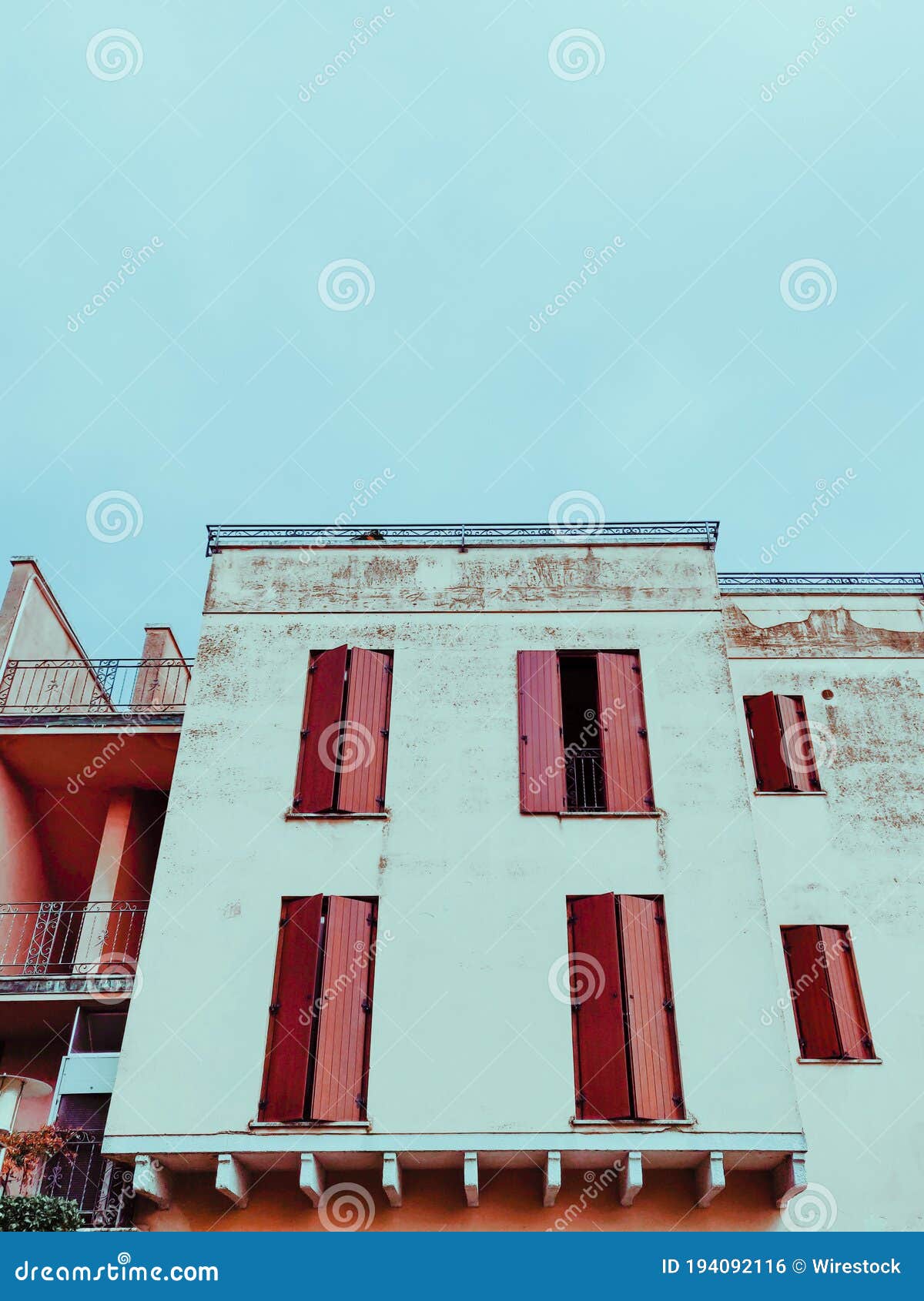 Low Angle Shot of a Building Under the Peaceful Sky Stock Photo - Image ...