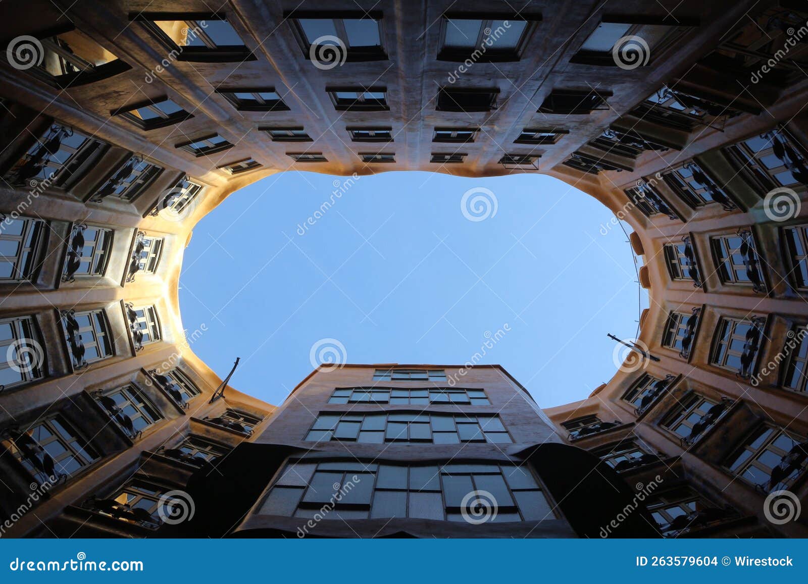 Low-angle Shot of a Circular Building with an Open Rooftop Looking at ...