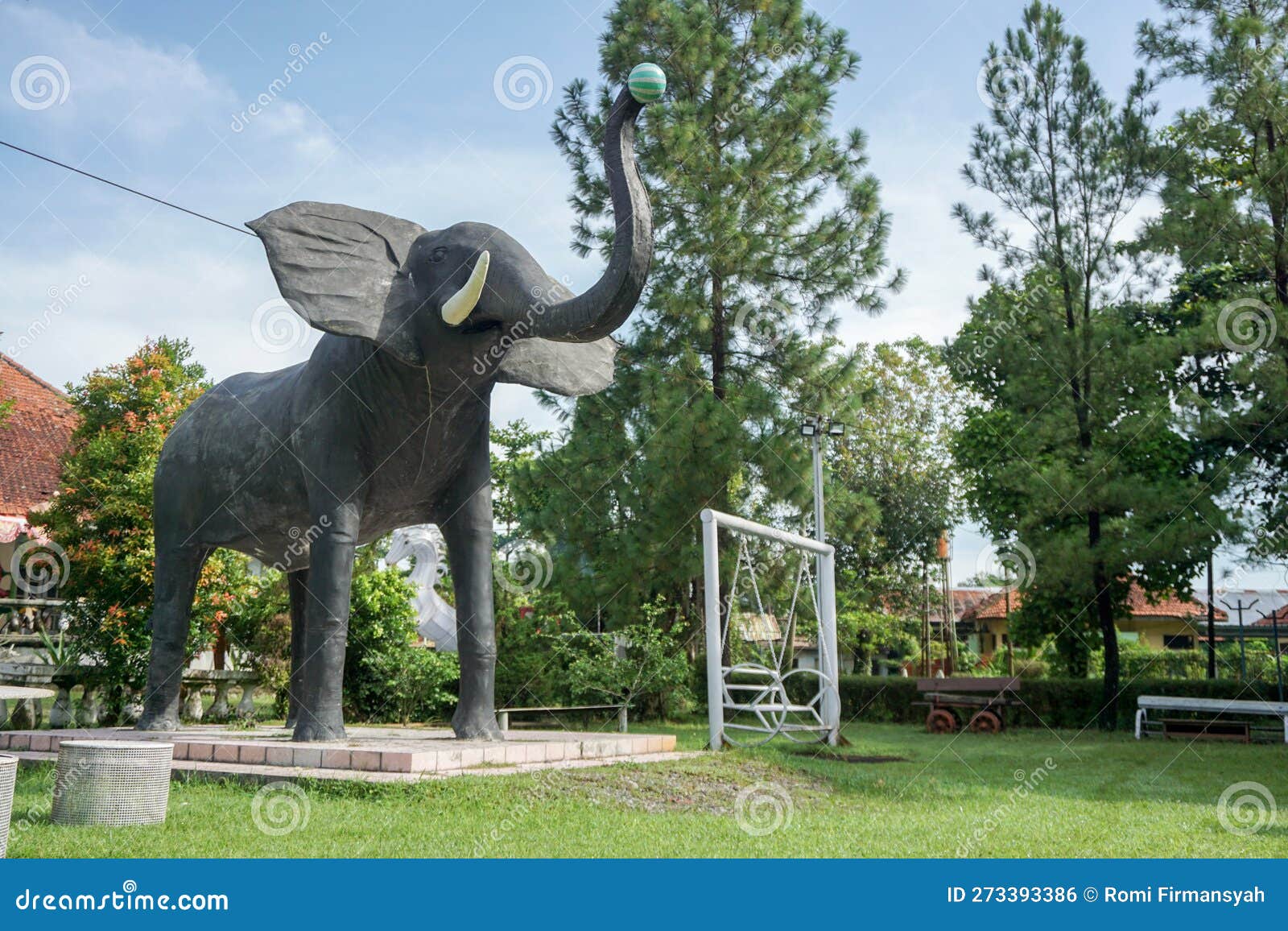 Low Angle Shot of an Elephant Figure in a Park with Negative Space on ...