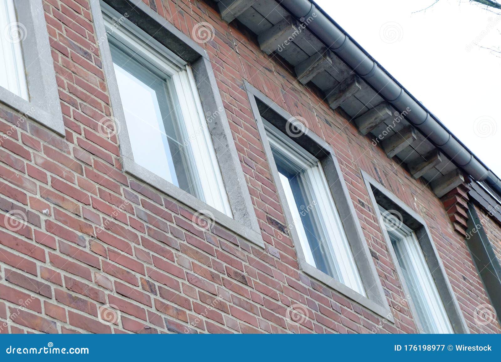Low Angle Shot of the Facade of a Cobblestone Building with Windows ...