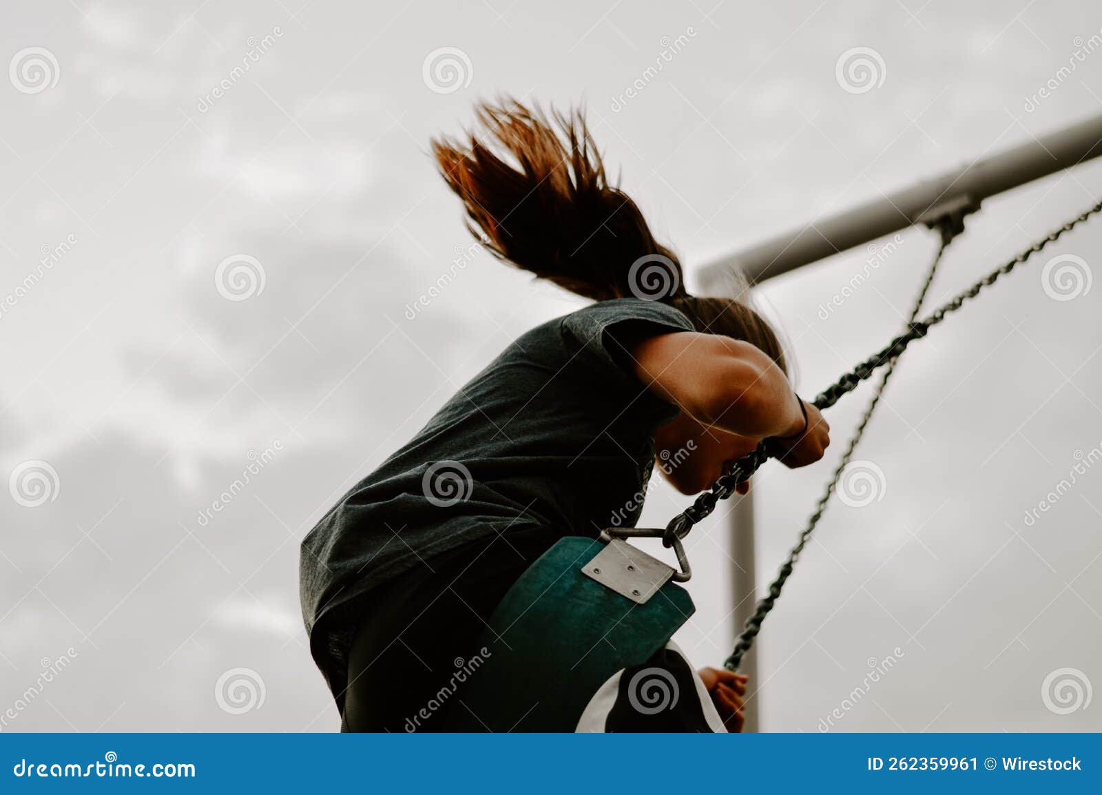 Low Angle Shot of a Female Swinging on a Swing Stock Image - Image of ...