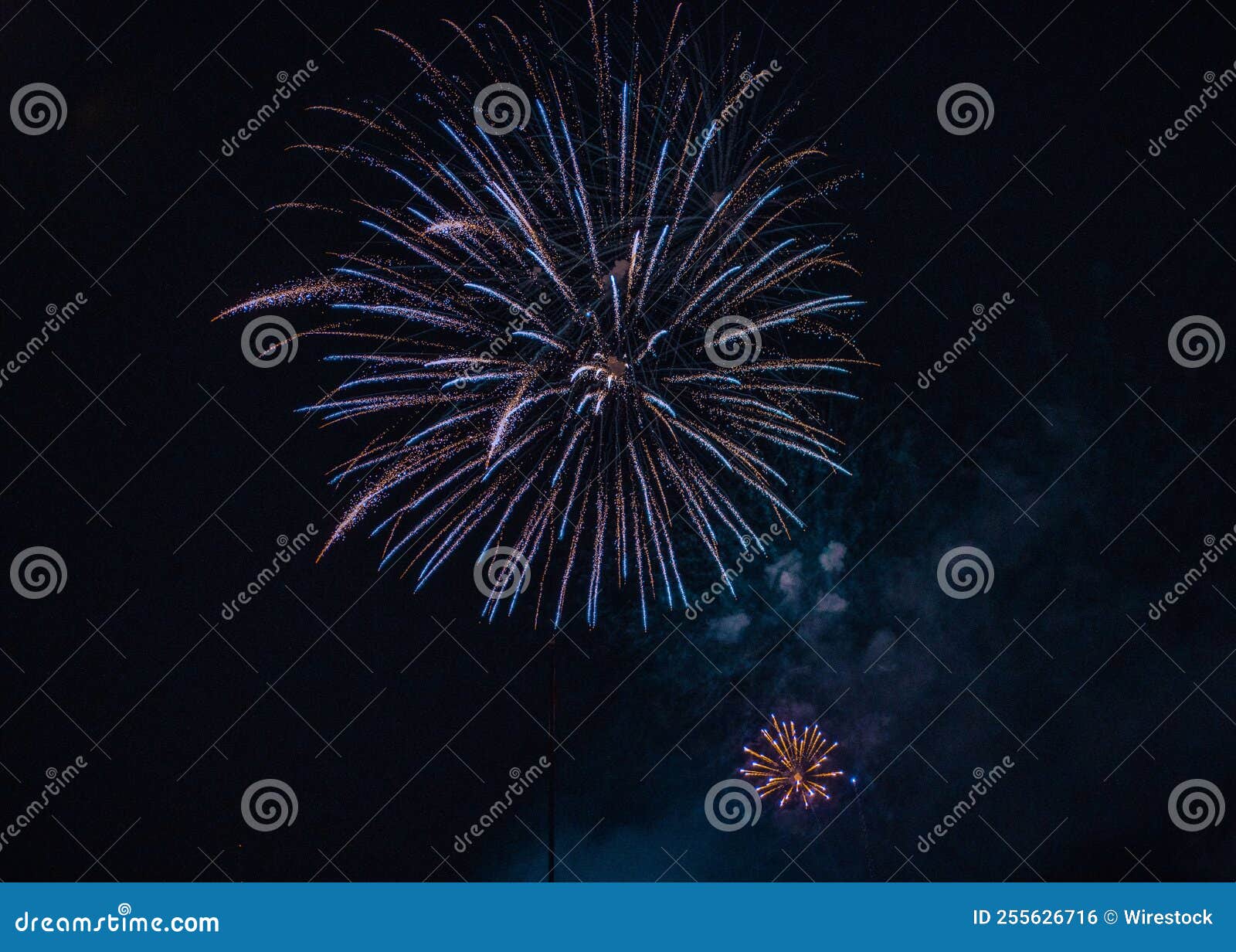 Low Angle Shot of Glowing Fireworks Popping in the Night Sky Stock ...