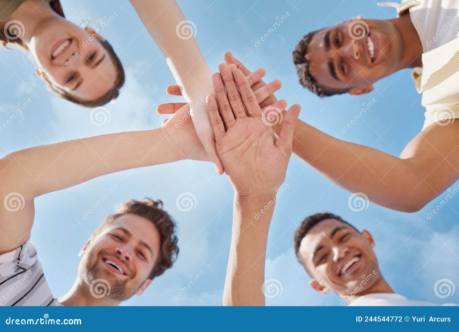 Friends on Three. Low Angle Shot of a Group of Young People Stacking ...