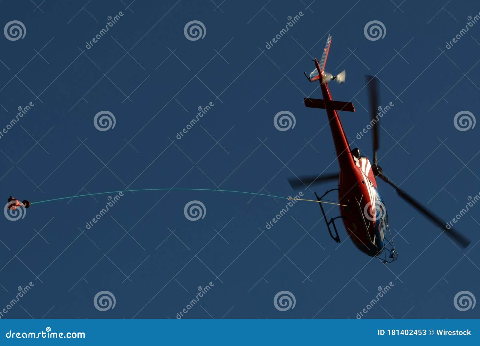 Low Angle Shot of a Helicopter with a Hook Flying in the Blue Sky Stock ...
