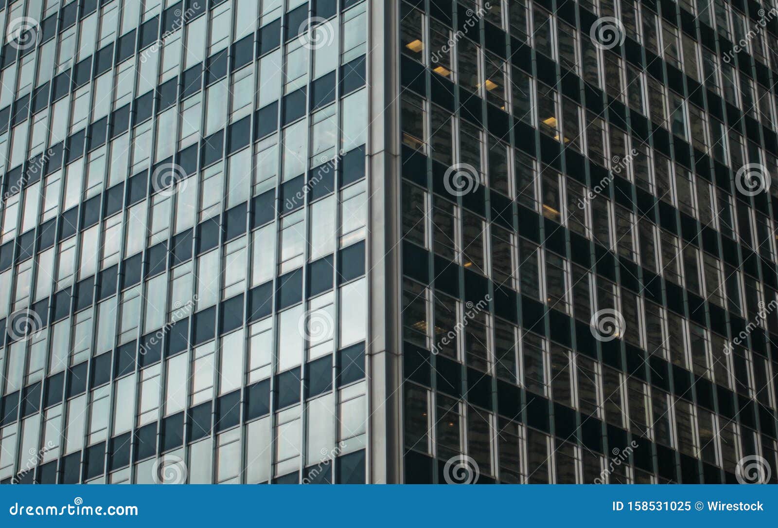 Low Angle Shot of a High Rise Architectural Building with Glass Windows ...
