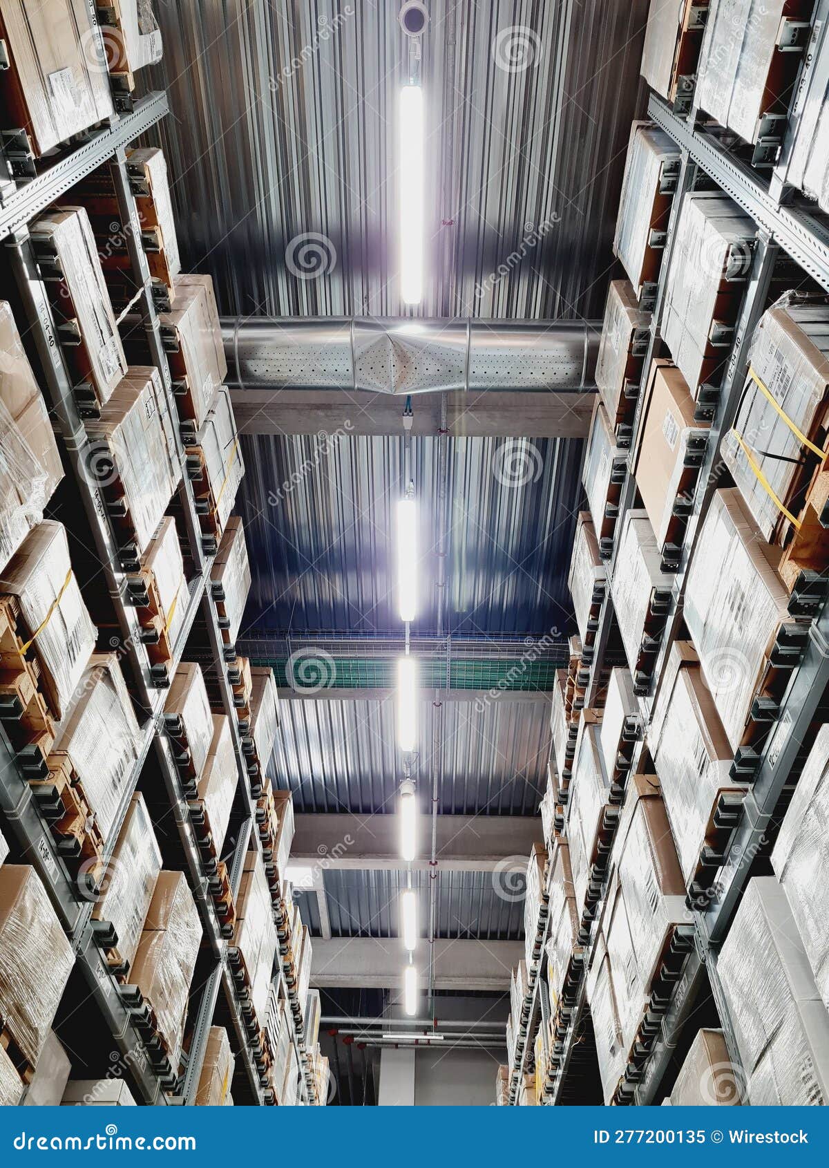 Low-angle Shot of an Illuminated Corridor of an Industrial Warehouse ...