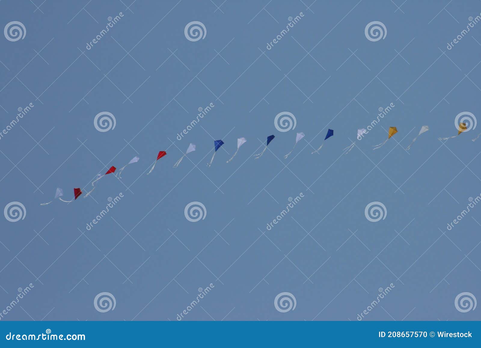 Low Angle Shot of Kites Floating in the Clear Blue Sky Stock Photo ...