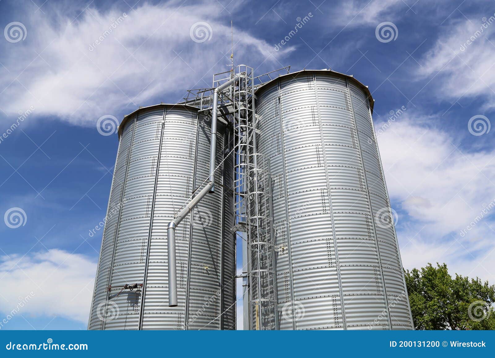 Low Angle Shot of Metallic Silos in White Over the Sky Stock Photo ...