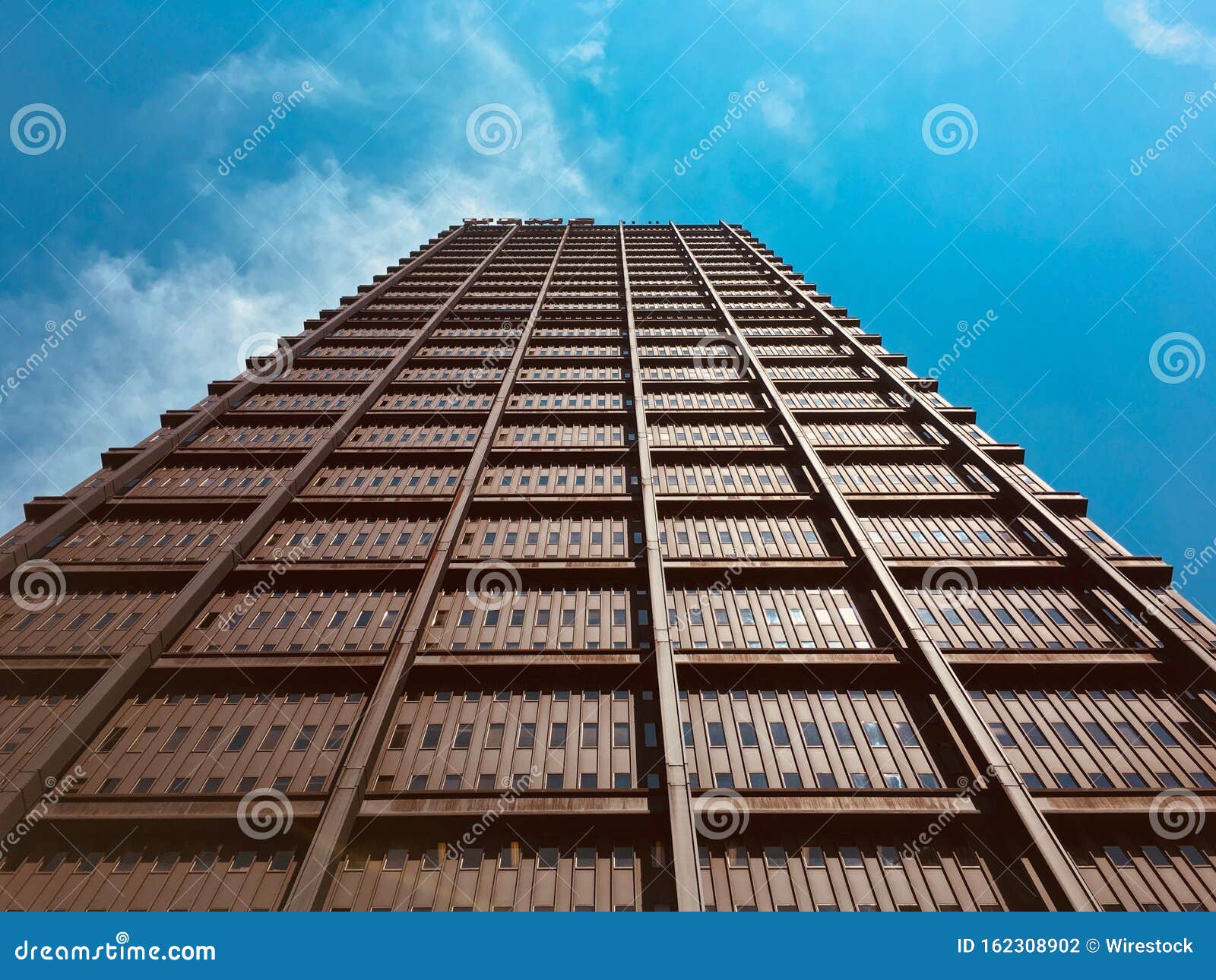 Low Angle Shot of a Modern Skyscraper with See-through Windows Under ...