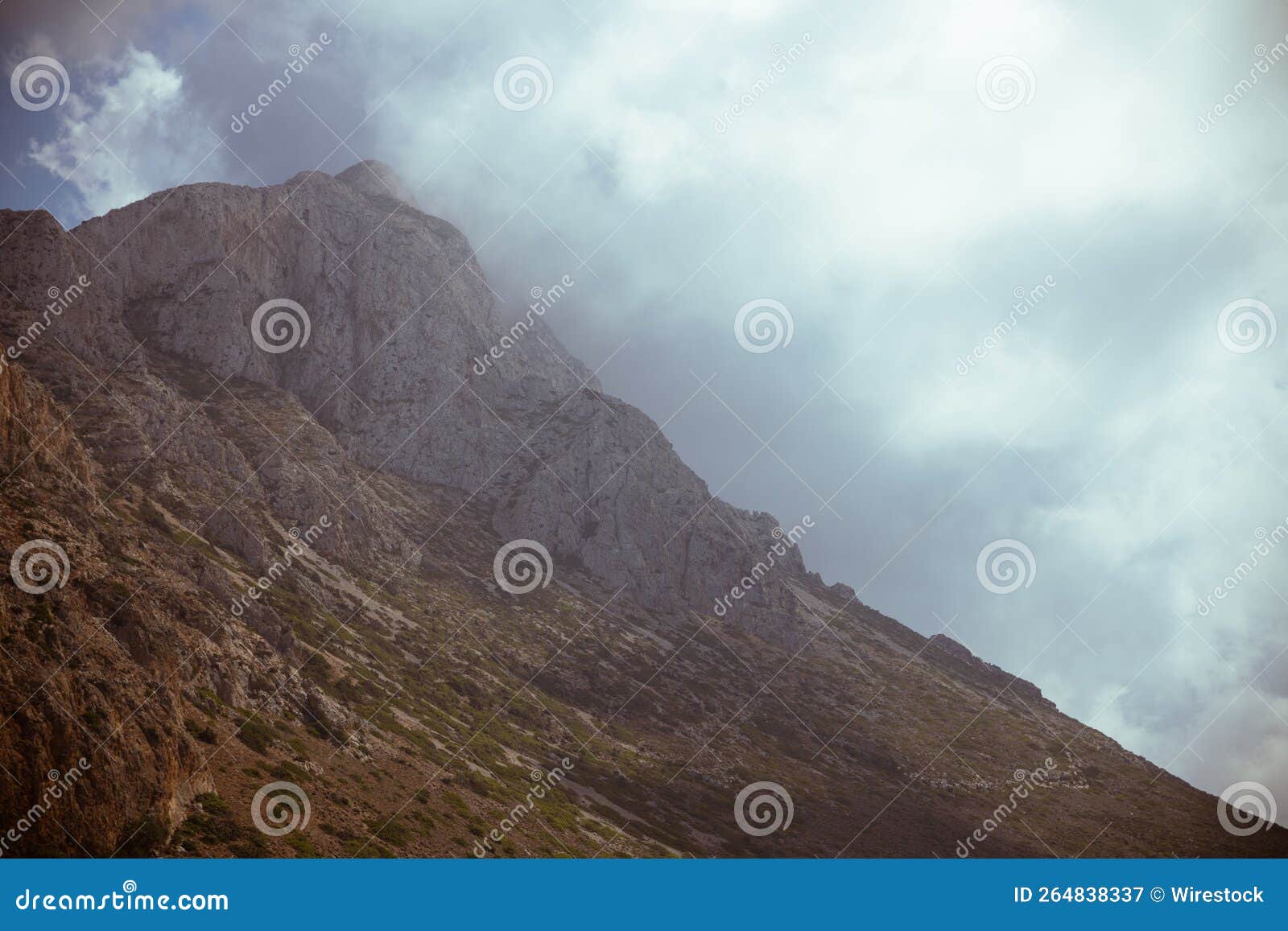 Low-angle Shot of Mountain Summits Touching the Clouds in Crete, Greece Stock Image - Image of ...
