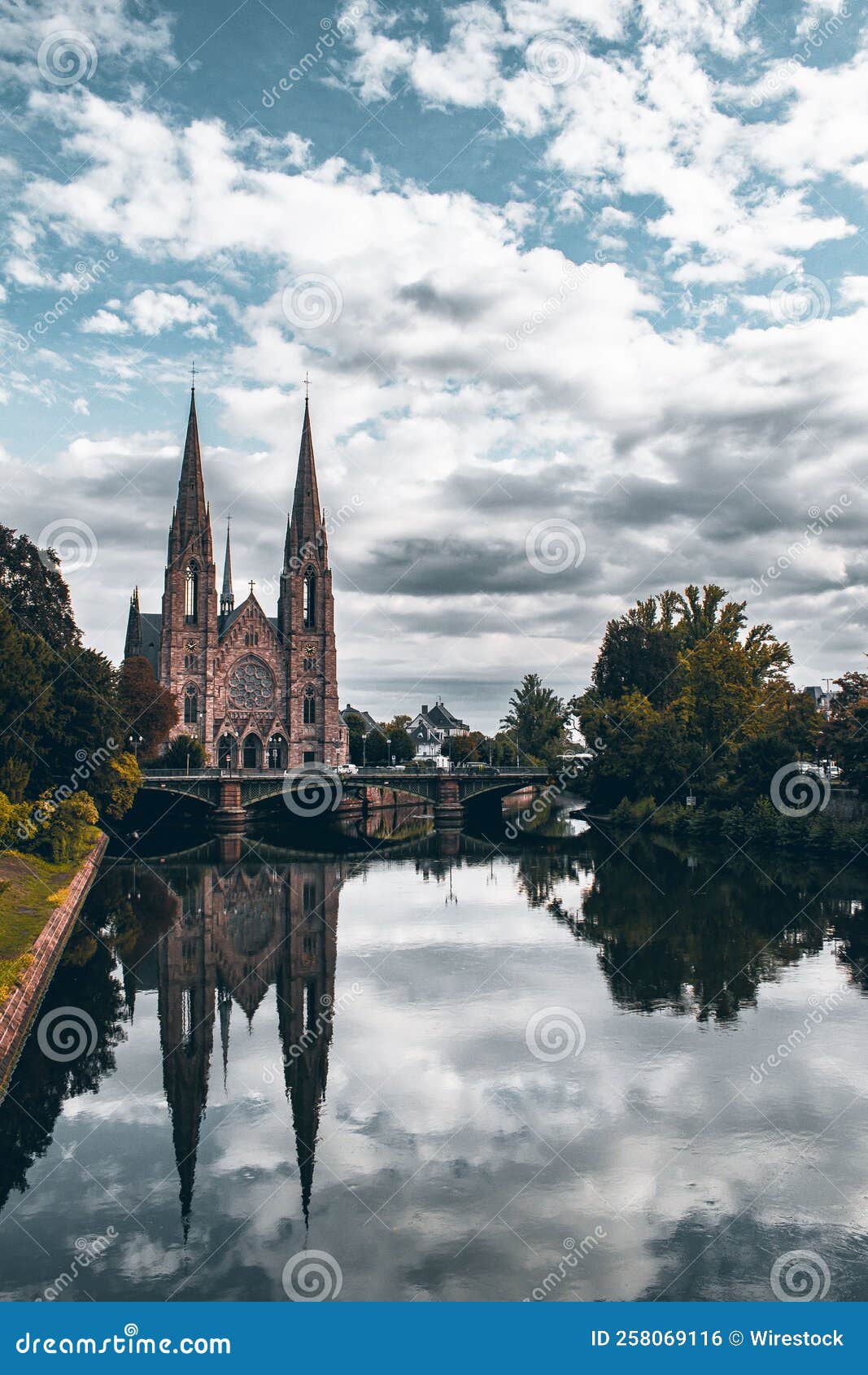 Low-angle Shot O Castles Reflection on the Water with a Cloudy Blue Sky ...