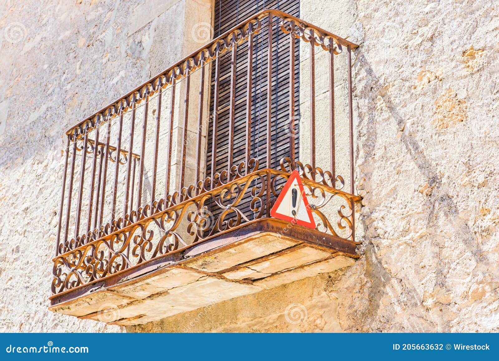 Low-angle Shot of an Old Balcony with a Warning Sign on the Side in ...