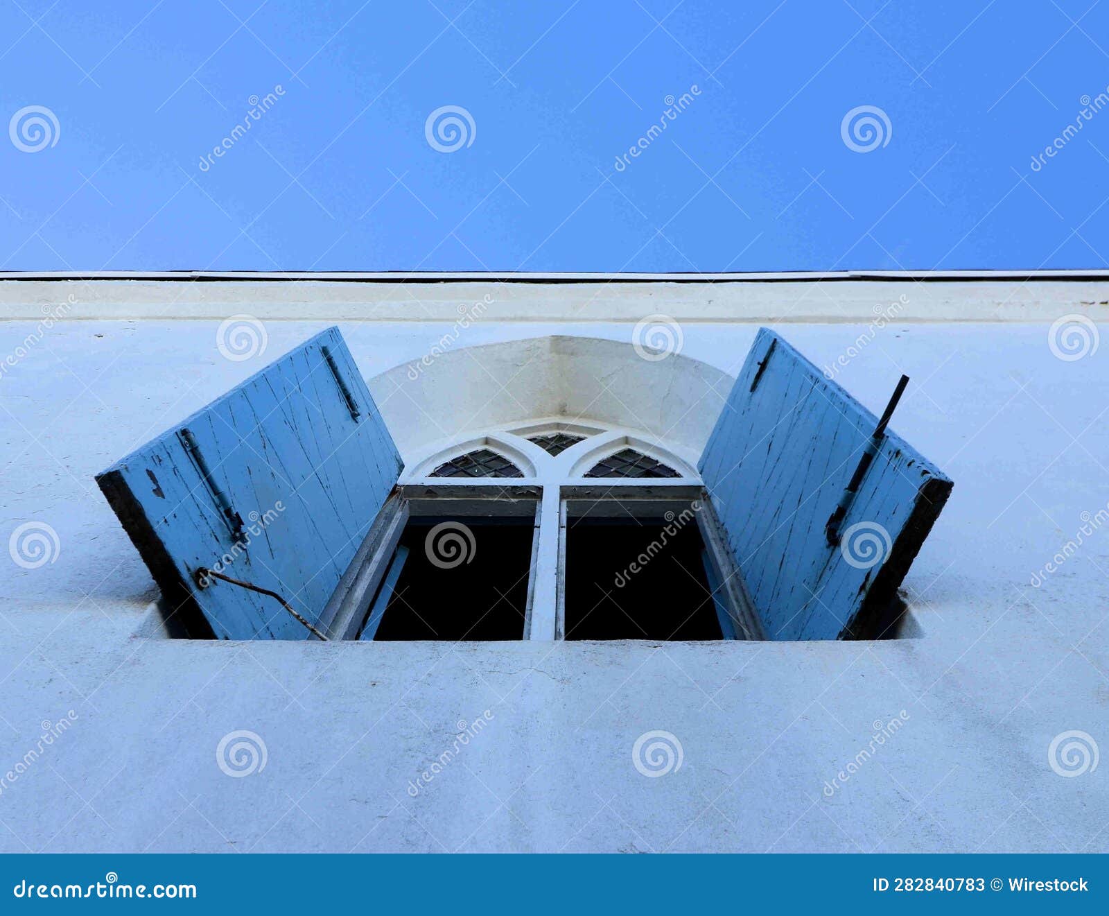 Low-angle Shot of an Open Window with a Blue Shutter on a White Wall ...