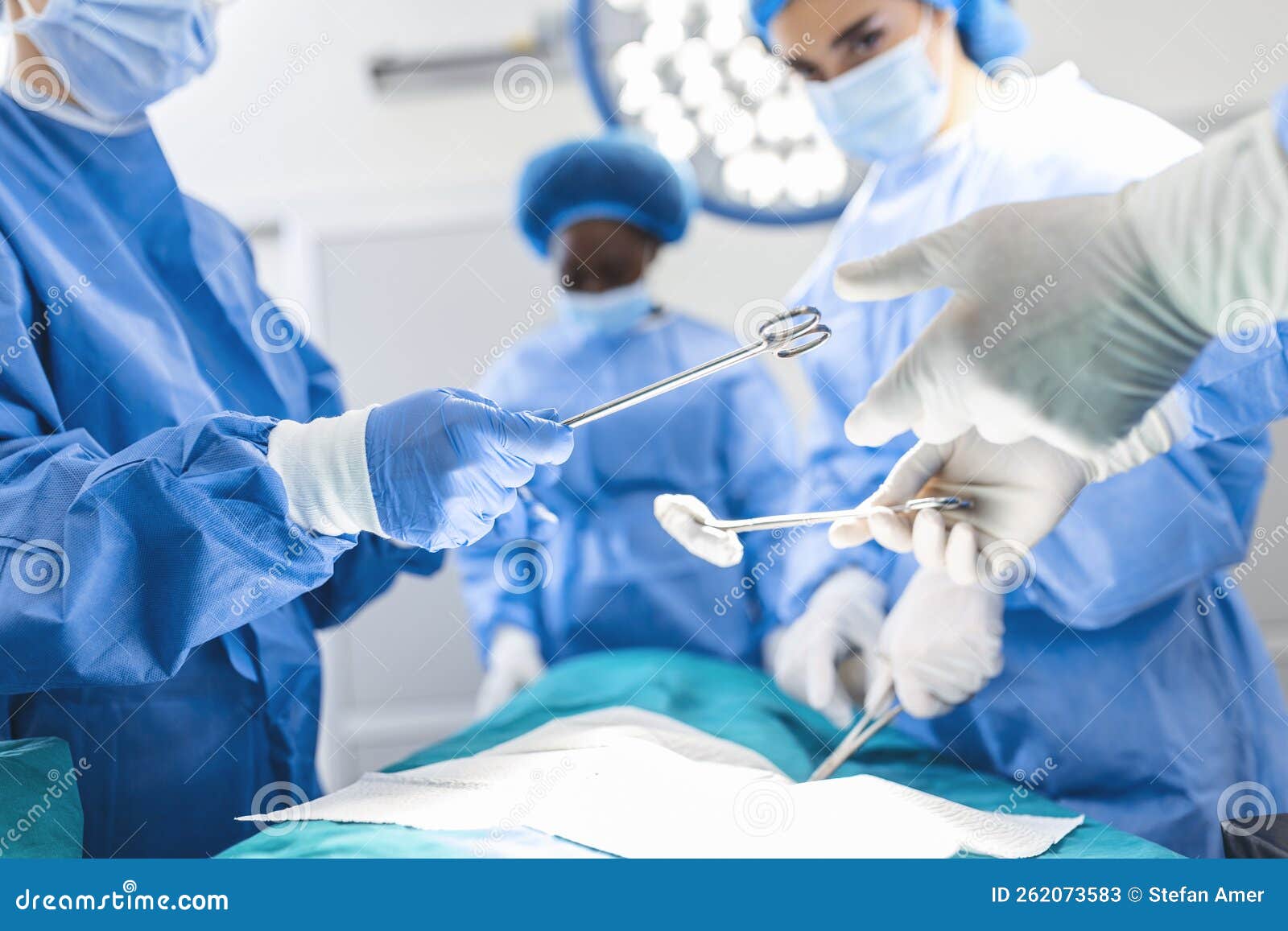 Low Angle Shot in the Operating Room, Assistant Hands Out Instruments ...