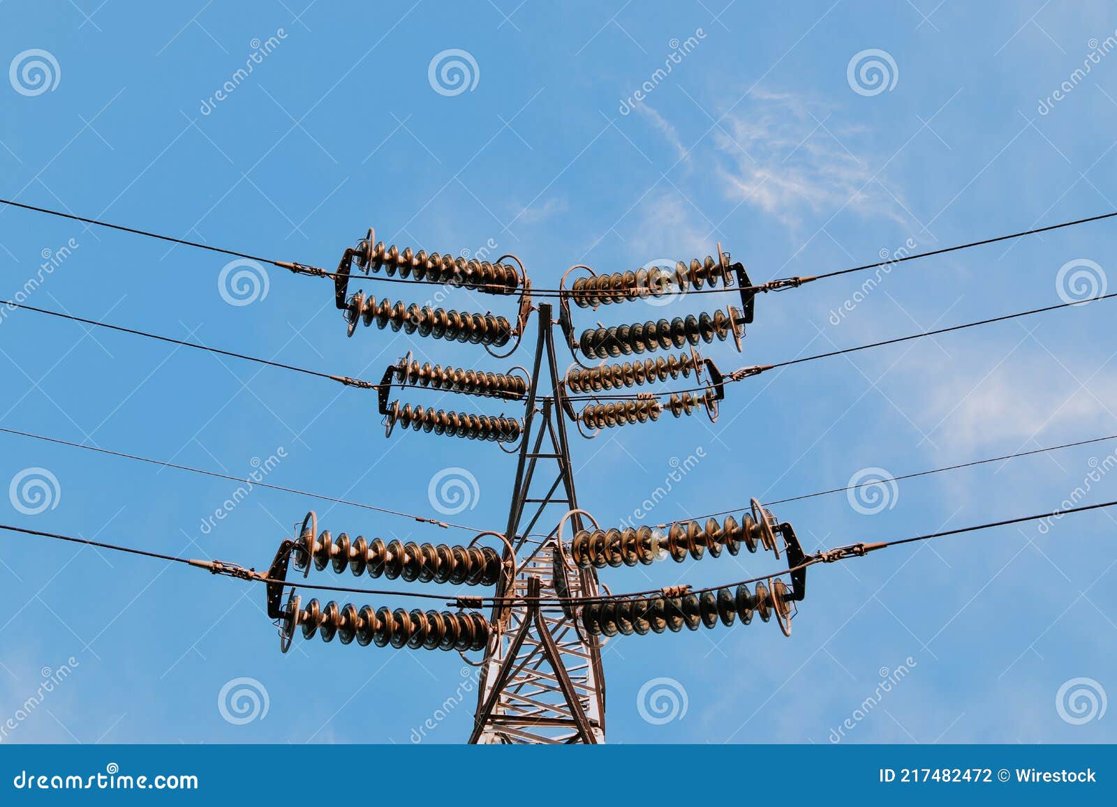 Low Angle Shot of Overhead Electric Power Lines with Insulators Stock ...