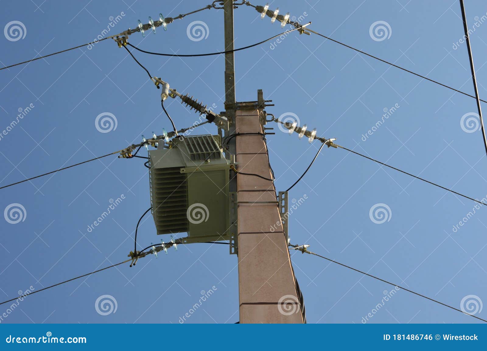 Low Angle Shot of Overhead Electric Power Lines Under a Blue Sky Stock ...