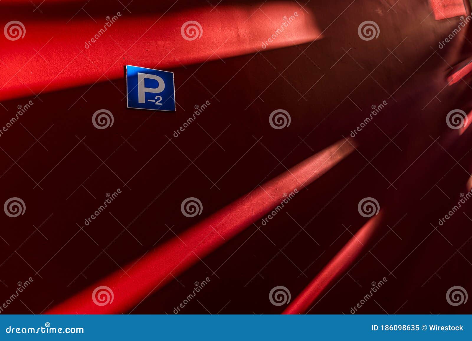 Low Angle Shot of a Parking Level Sign on a Red Wall Stock Image ...