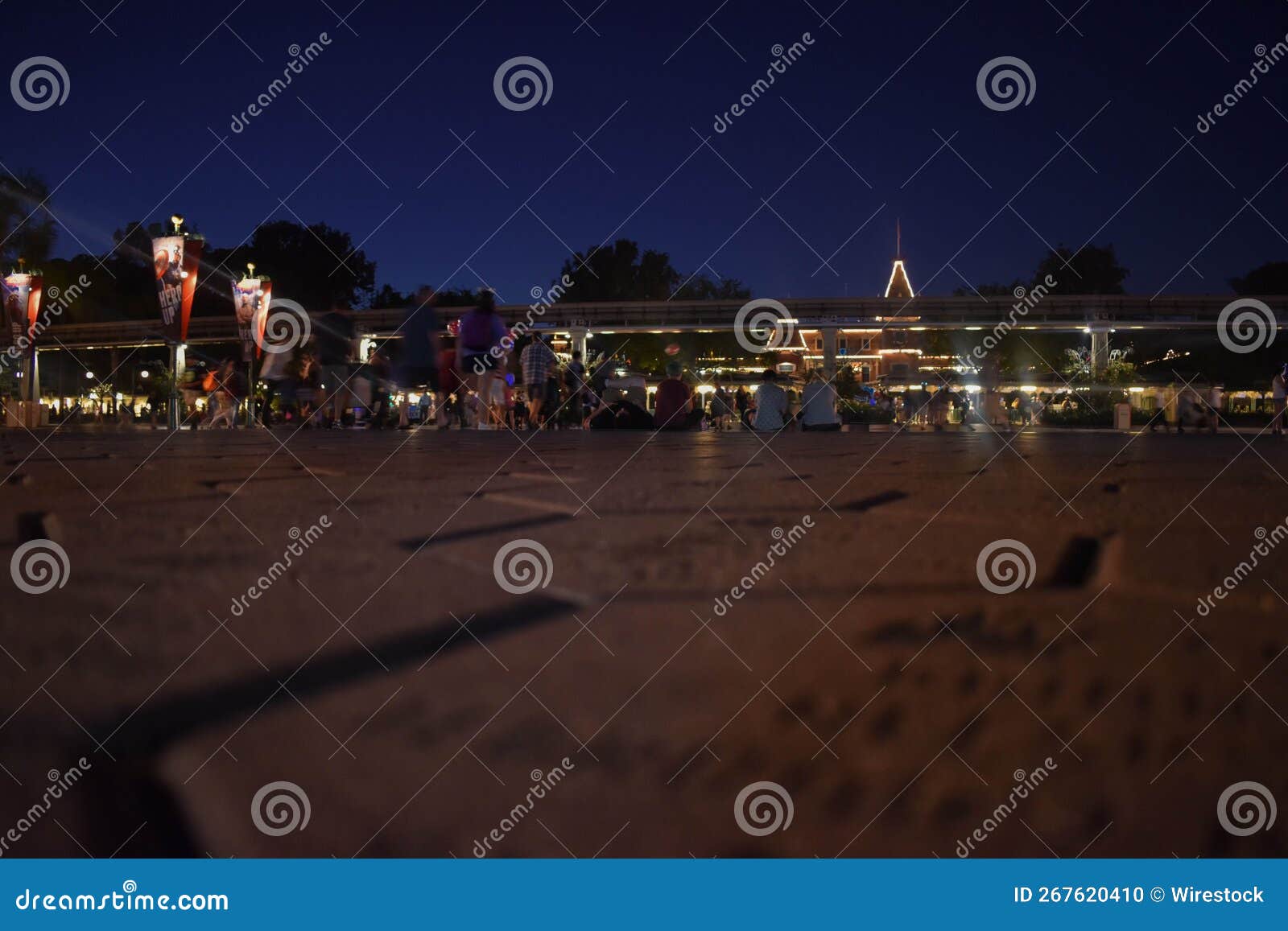 Low-angle Shot of People Walking on a Square during an Evening Stock ...