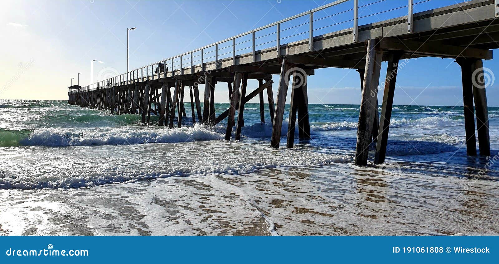 Low Angle Shot of the Pier by the Beach Captured on a Sunny Day Stock ...