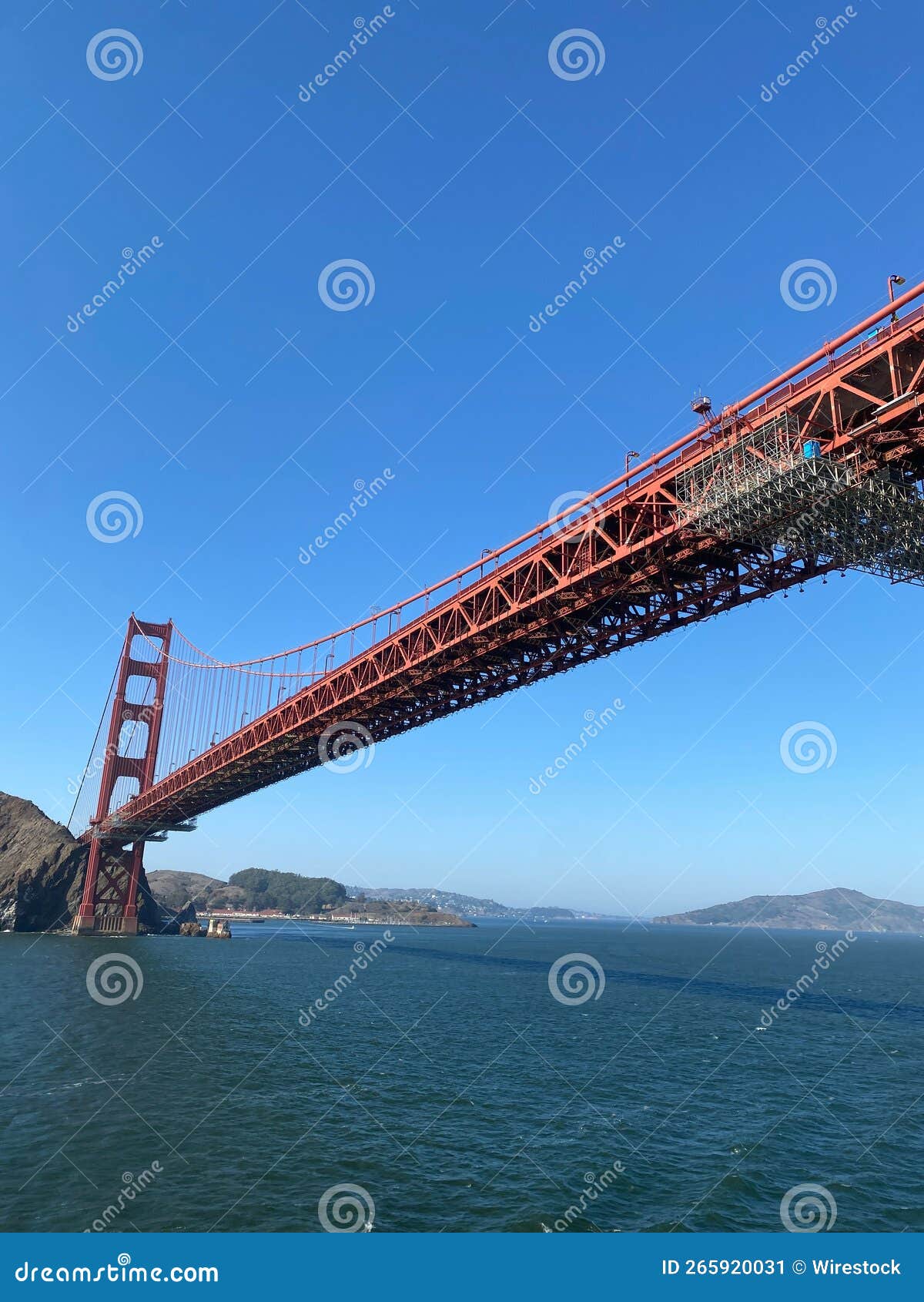 Low Angle Shot of a Red Steel Bridge with a Blue Sky Background Stock ...