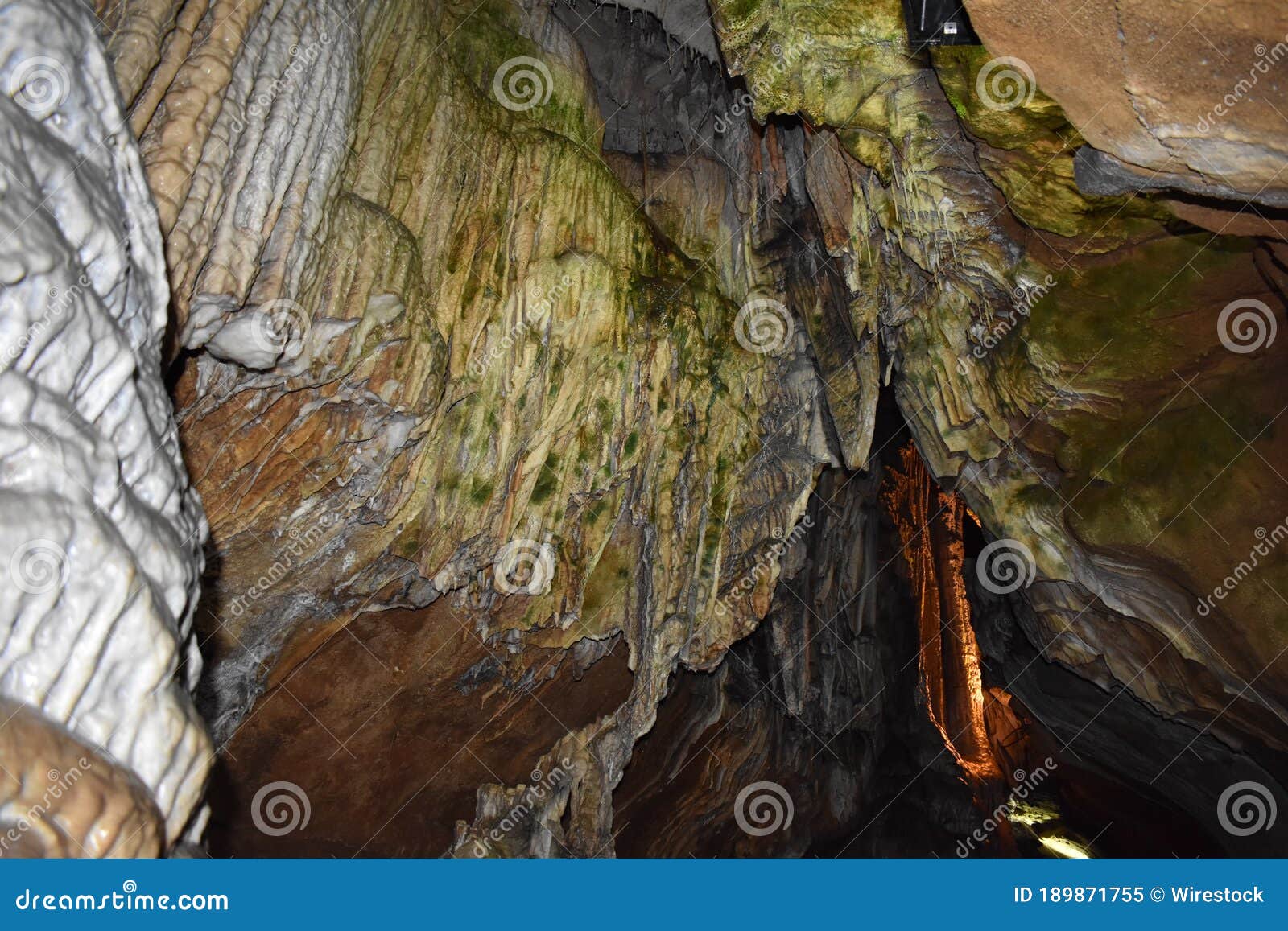 Low Angle Shot of a Rocky Cave Partially Covered with Moss Stock Image ...