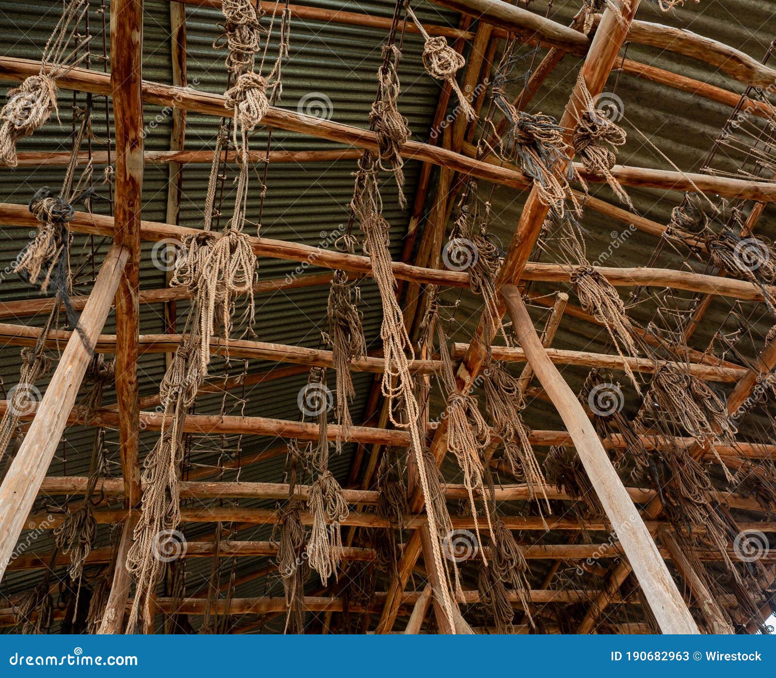 Low Angle Shot of Ropes Tangled on Wooden Columns Stock Image - Image ...