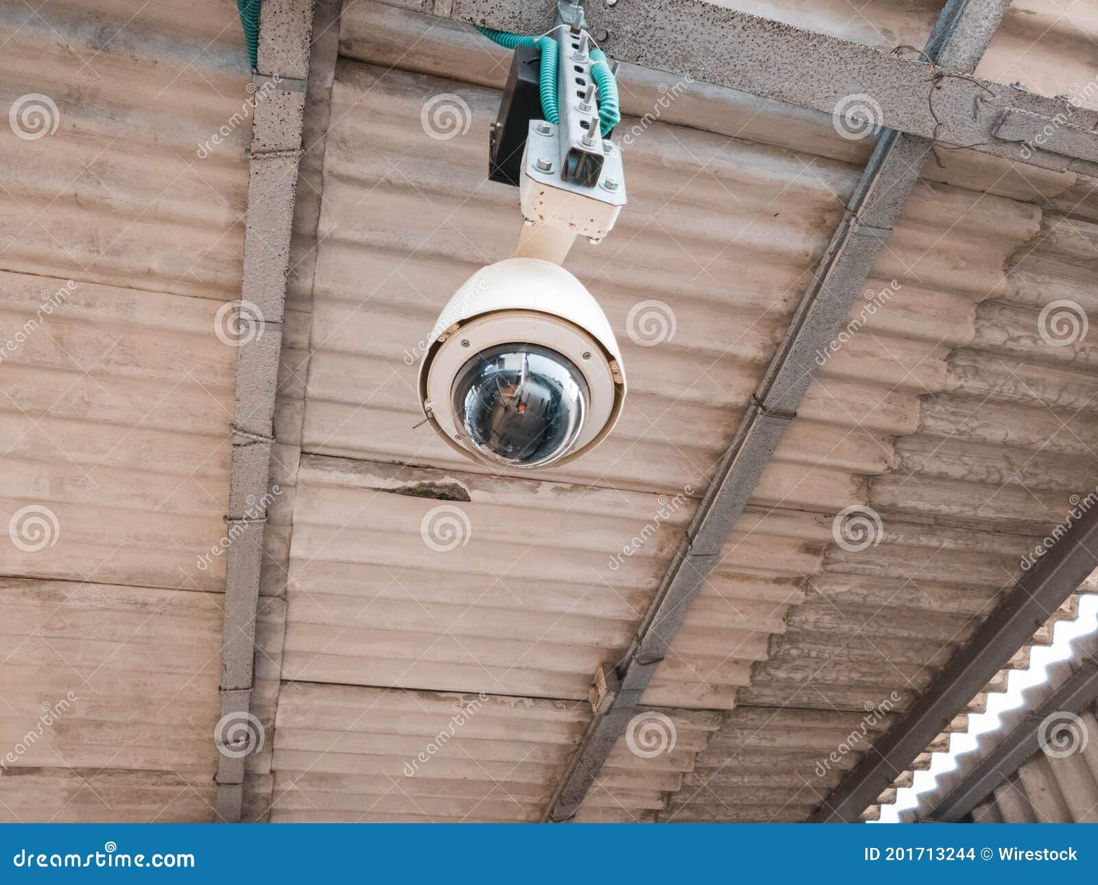 Low Angle Shot of a Security CCTV Camera at the Ceiling in a Building ...