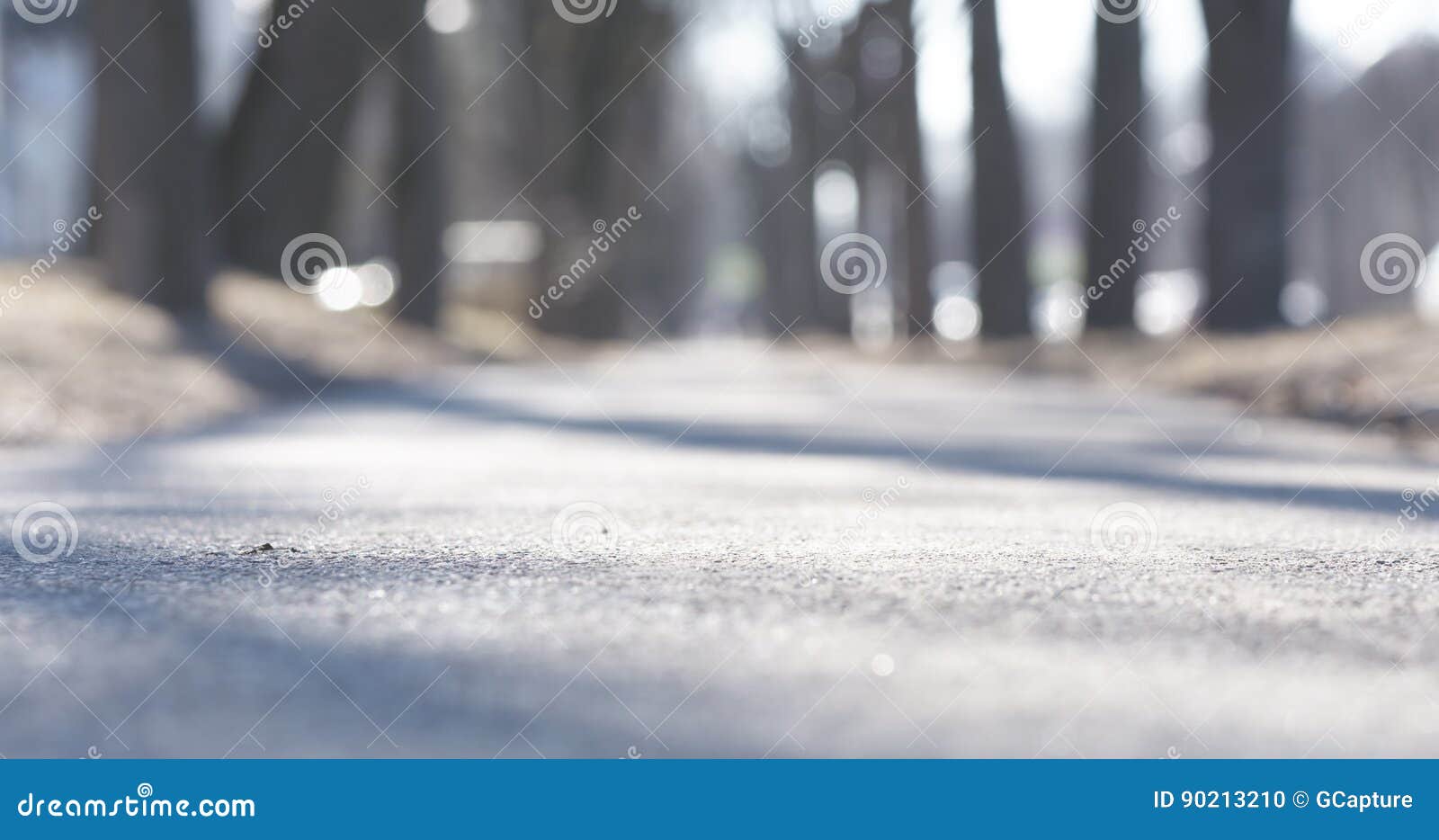 Low Angle Shot of Sidewalk in Town in Spring Focus Close To Camera ...