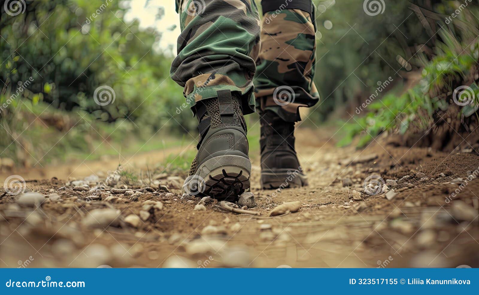A Low-angle Shot of a Soldiers Feet Walking on a Dirt Path through a ...