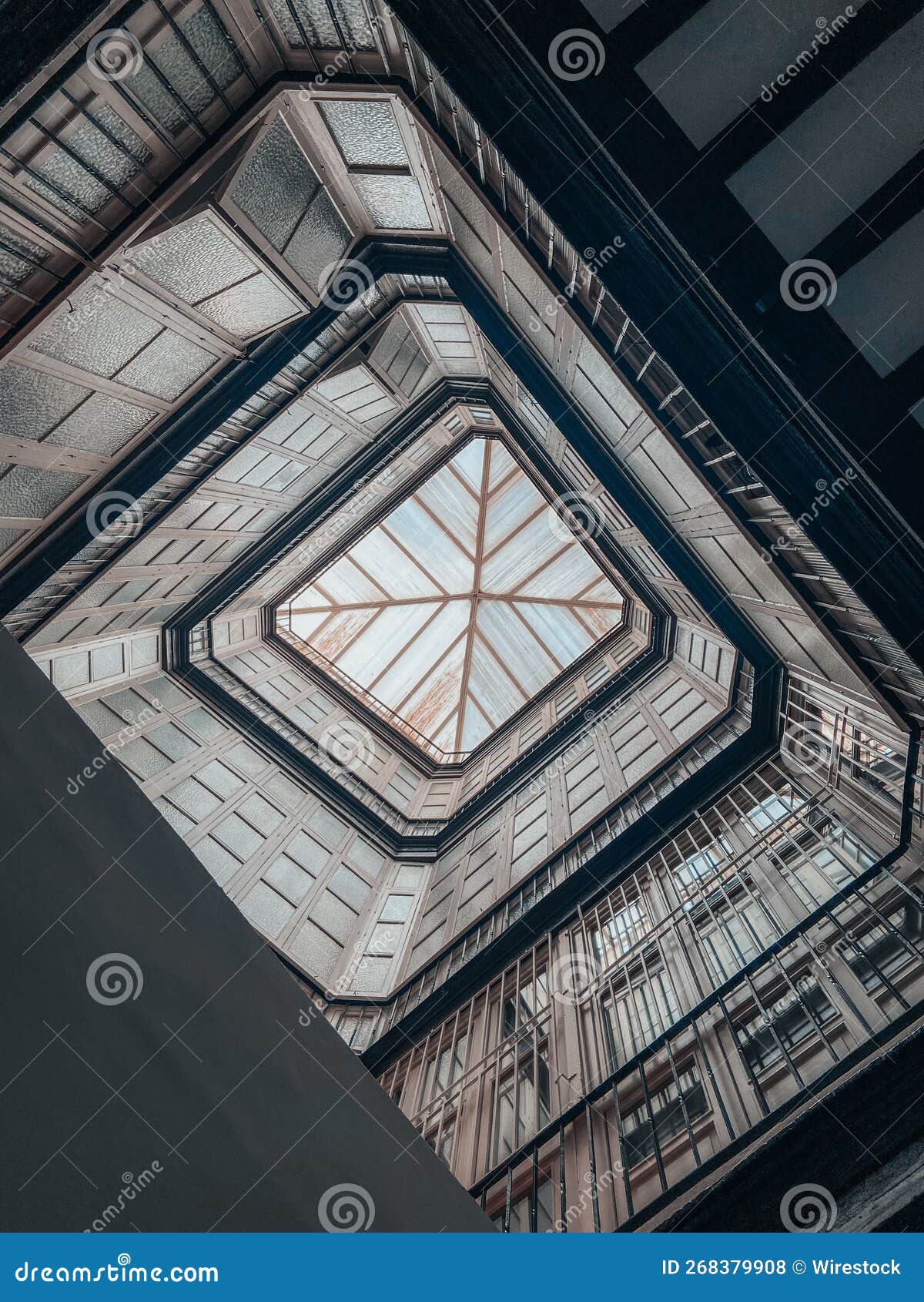 Low Angle Shot of a Square Building with Glass Ceiling and a Lot of ...