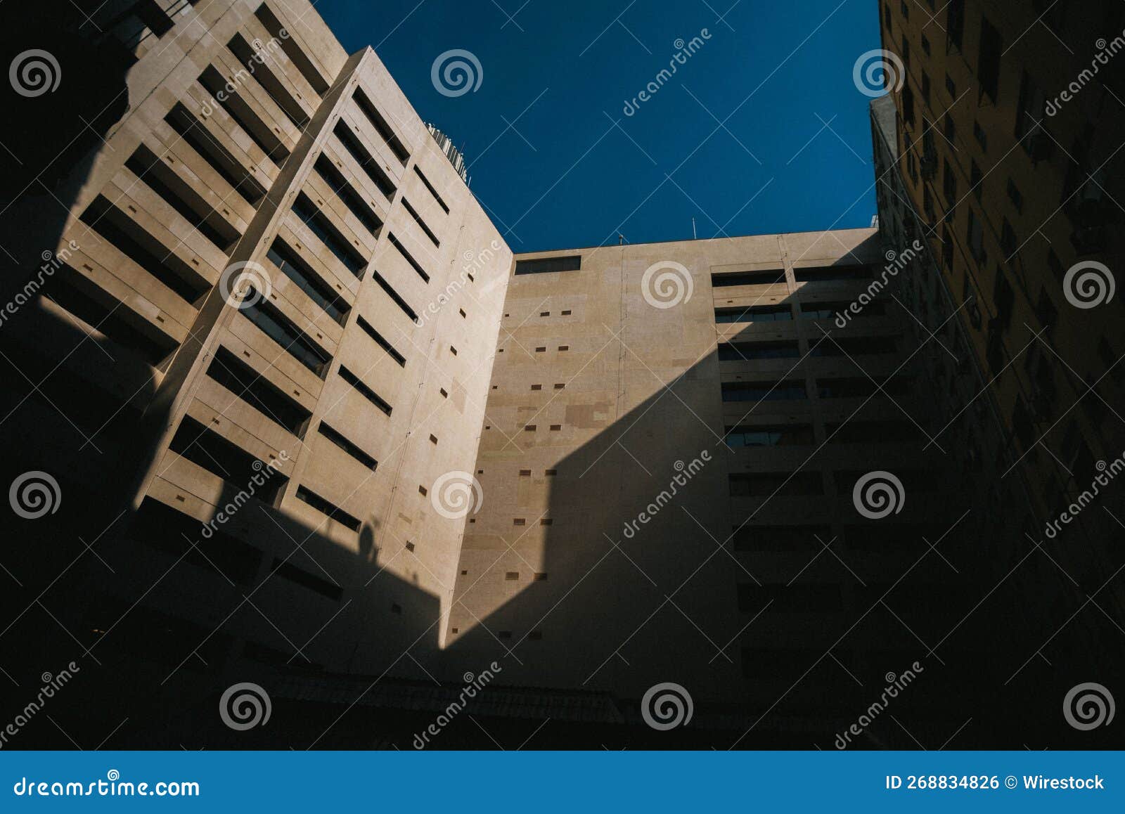 Low-angle Shot of the Sunlight Falling on the Monotonous Beige Facade ...