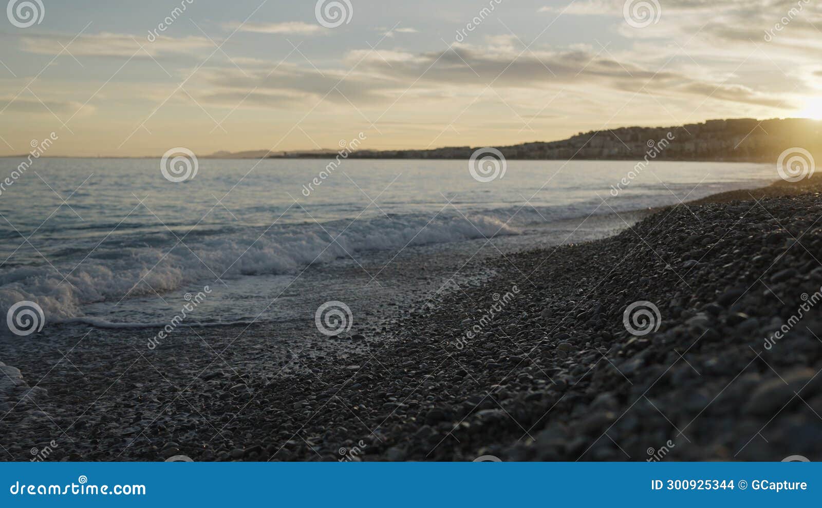 Low Angle Shot of Sunset on a Pebble Beach of Nice Stock Photo - Image ...