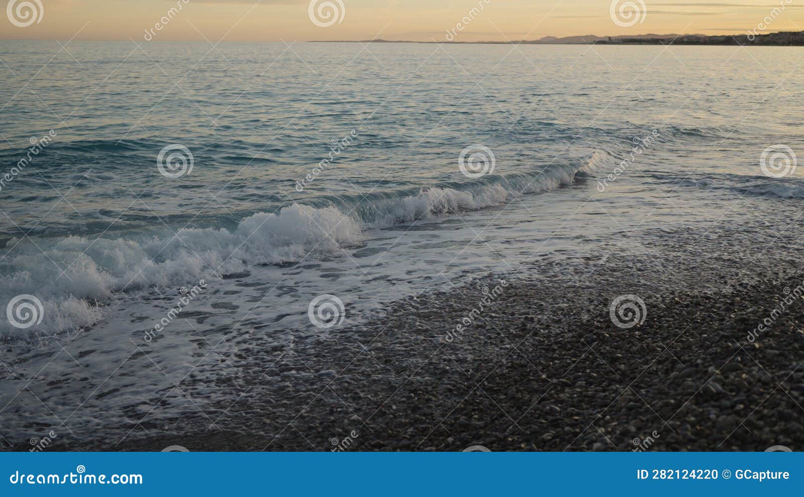 Low Angle Shot of Sunset on a Pebble Beach of Nice Stock Photo - Image ...