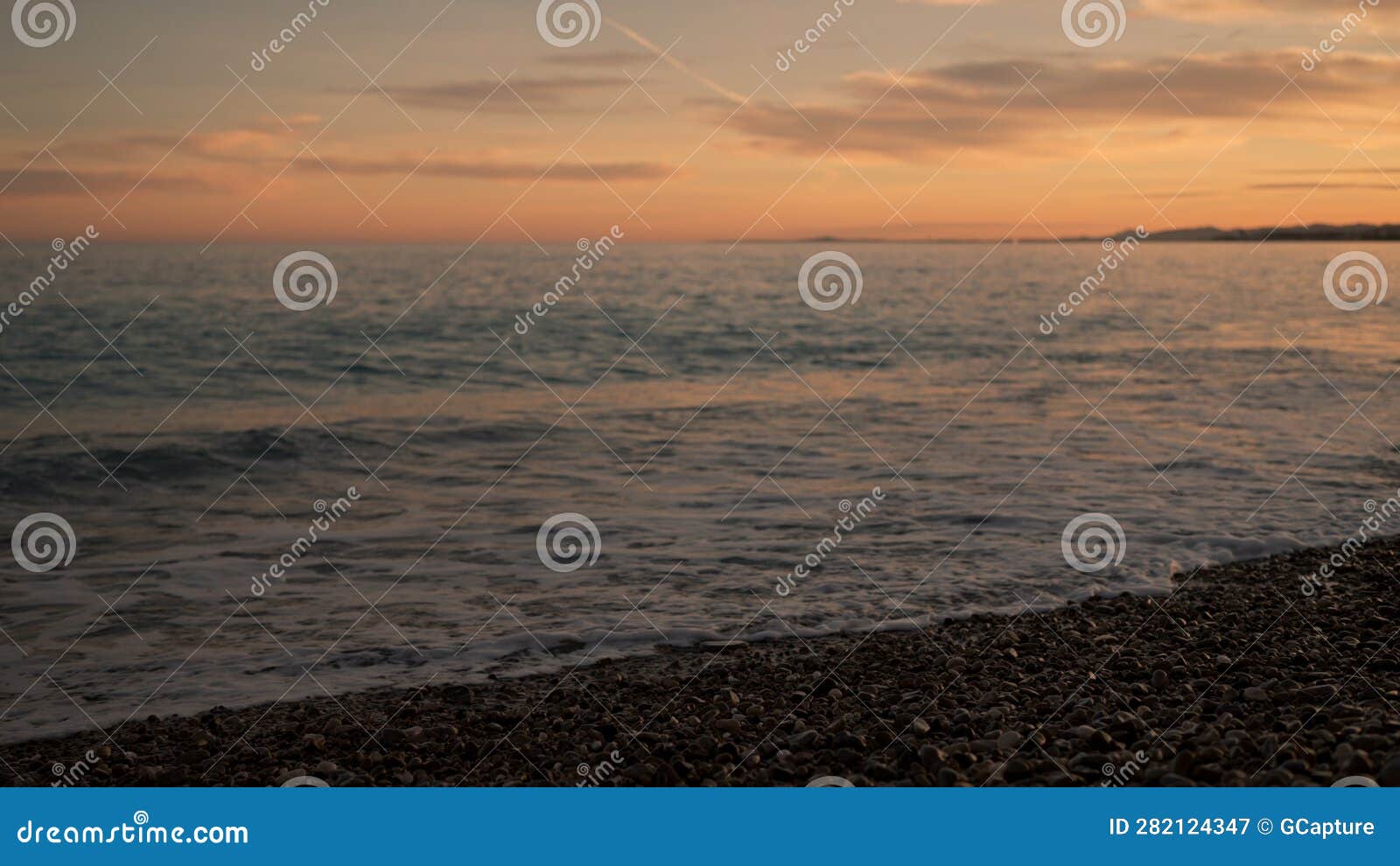 Low Angle Shot of Sunset on a Pebble Beach of Nice Stock Image - Image ...