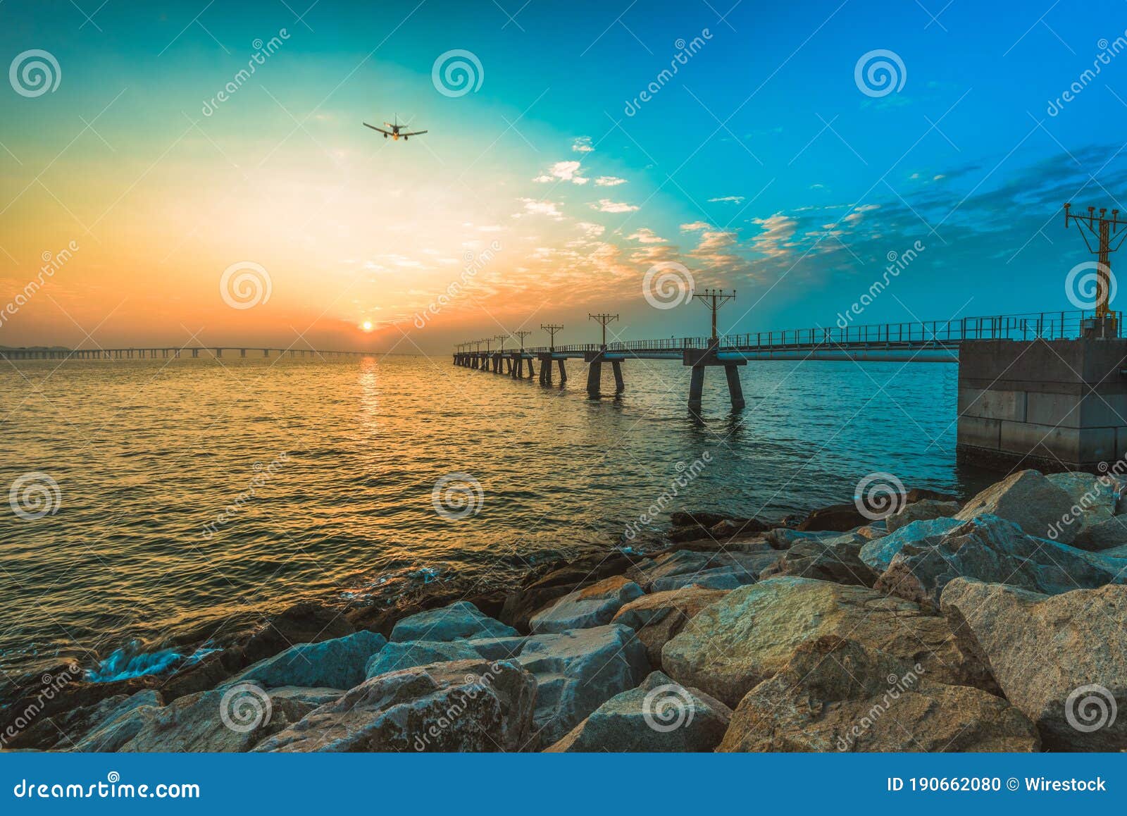 Low Angle Shot of a Suspension Bridge Over the Beautiful Ocean Captured ...