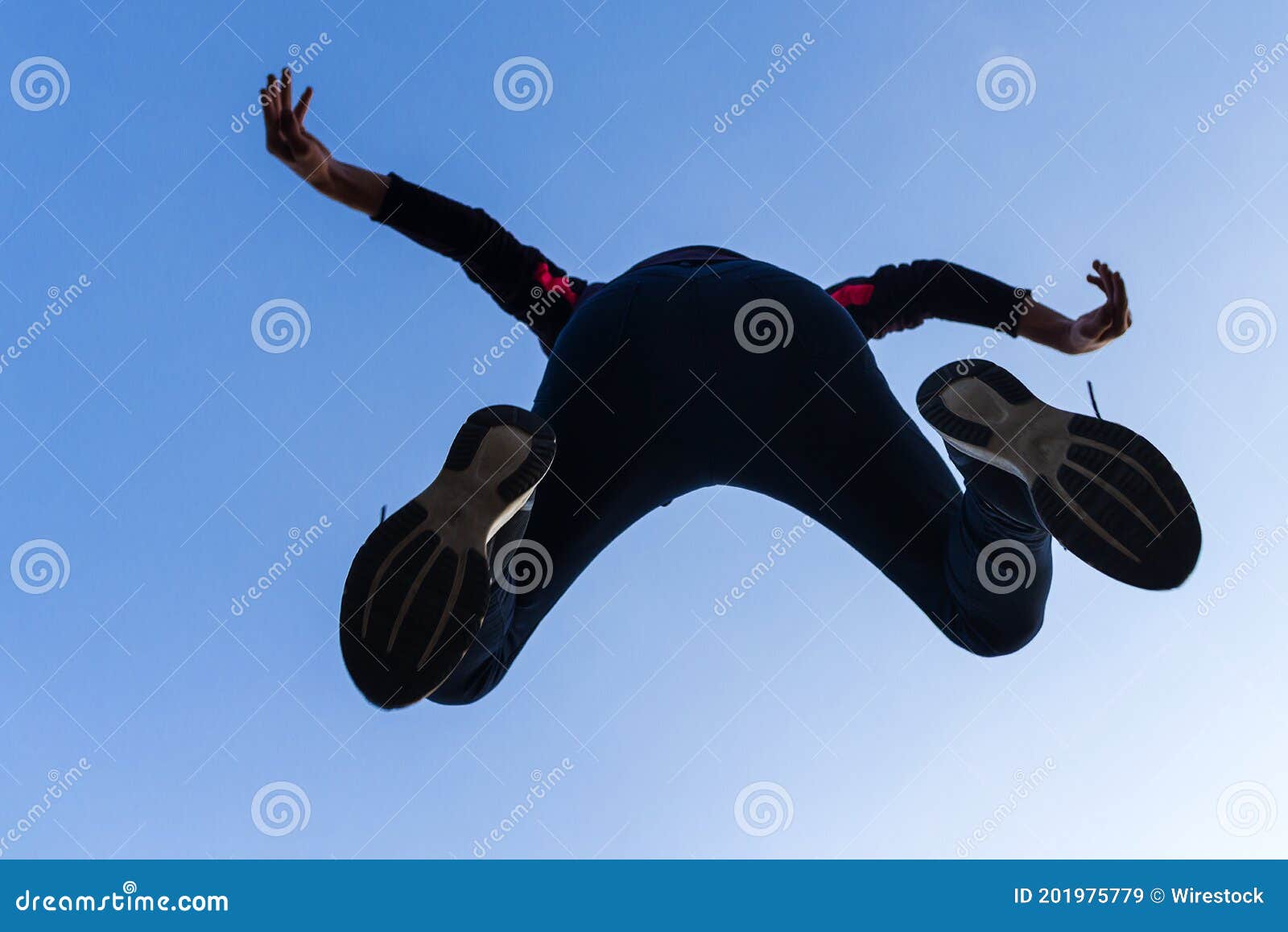 Low Angle Shot of a Teenager Jumping Stock Image - Image of portrait ...