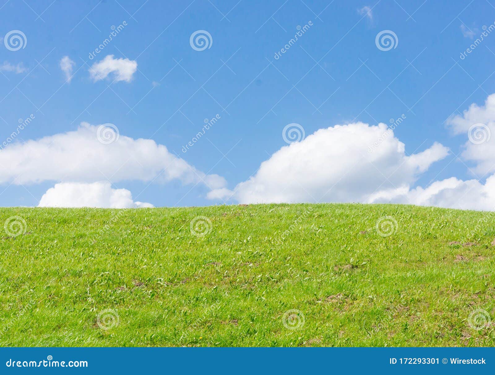 Low Angle Shot of the Top of a Hill with Grassy Field Stock Image ...