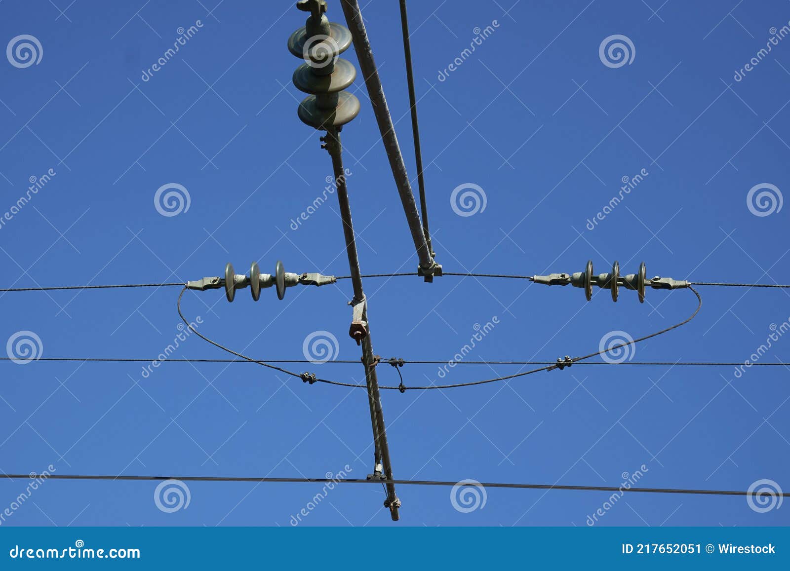 Low Angle Shot of Transmission Power Lines Under the Sunlight and a ...