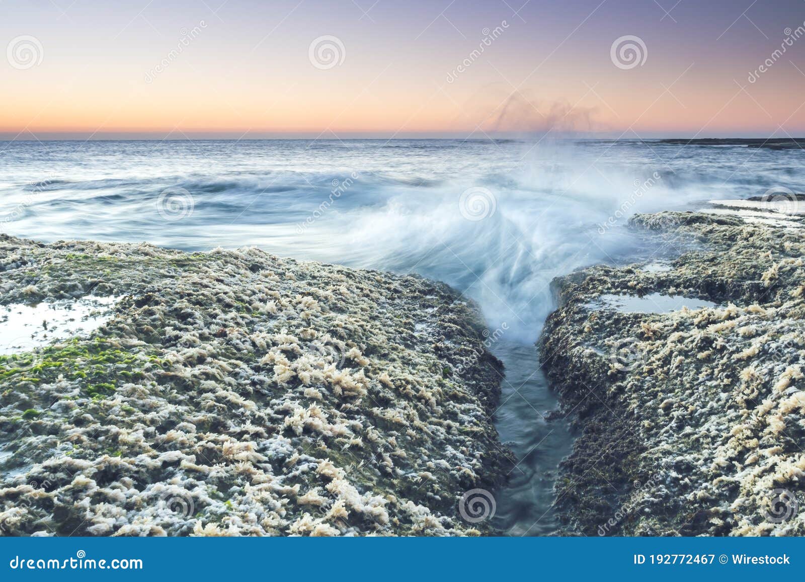 Low Angle Shot of the Water Hitting Rocks on the Shore Stock Image ...