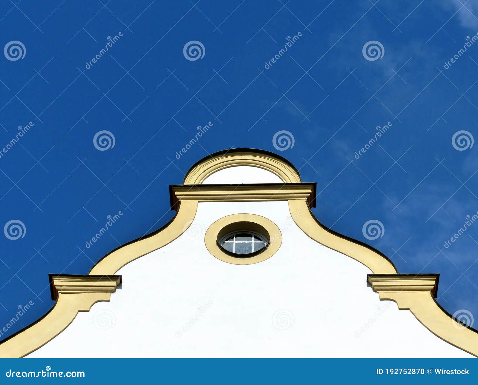 Low Angle Shot of a White Building Gable with a Small Circular Window ...