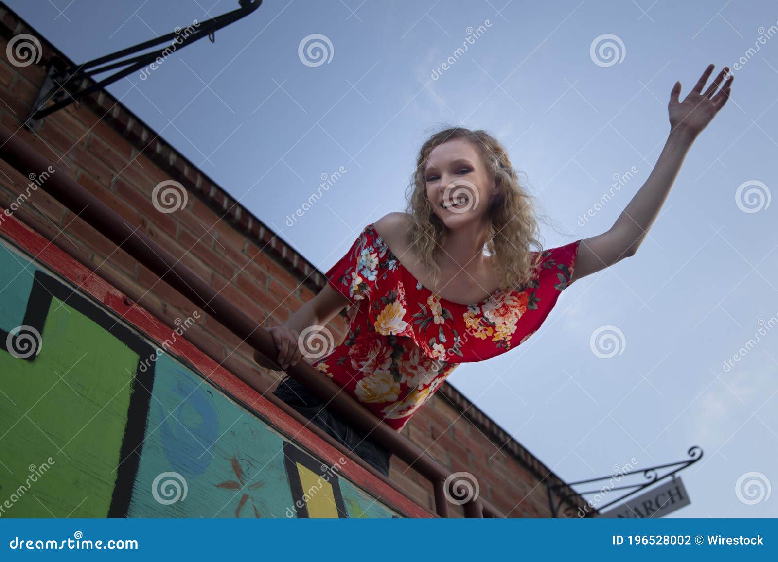 Low Angle Shot of a Young Attractive Female Posing at Camera Stock ...