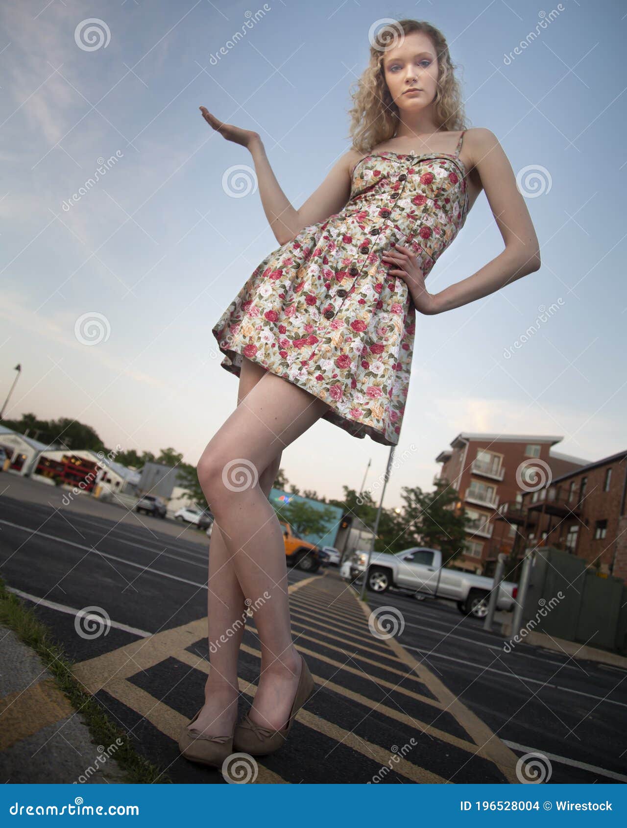 Low Angle Shot of a Young Attractive Female Posing at Camera Stock ...