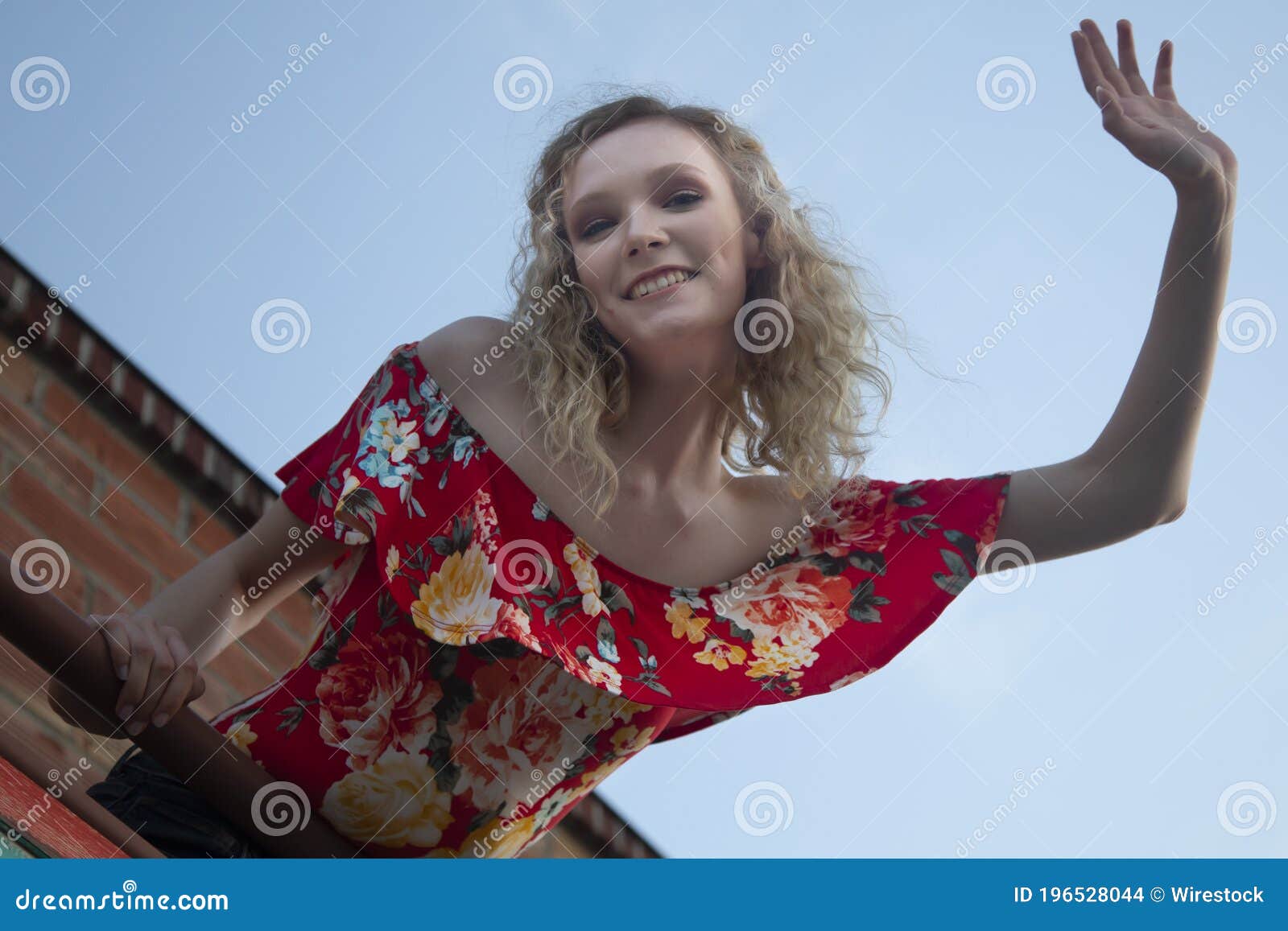 Low Angle Shot of a Young Attractive Female Posing at Camera Stock ...